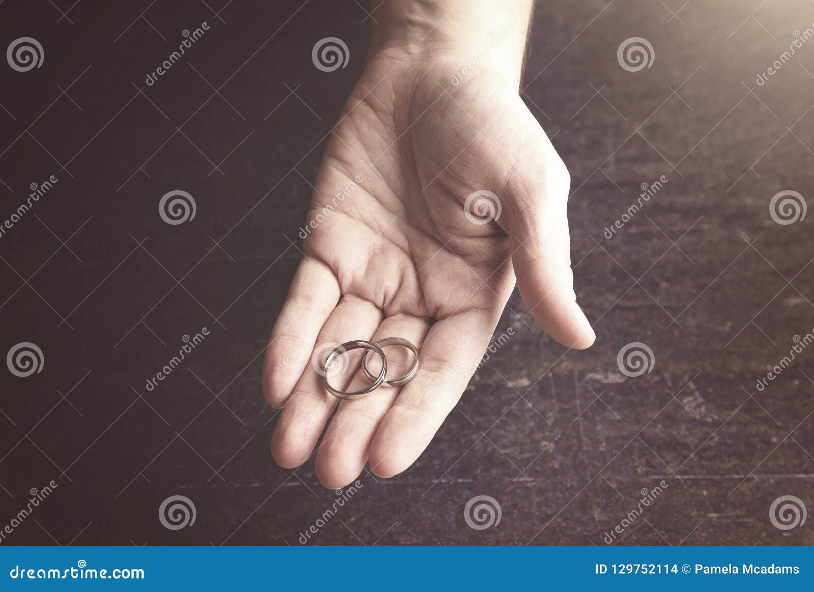 Person Offering a Pair of Wedding Rings Stock Photo - Image of person ...