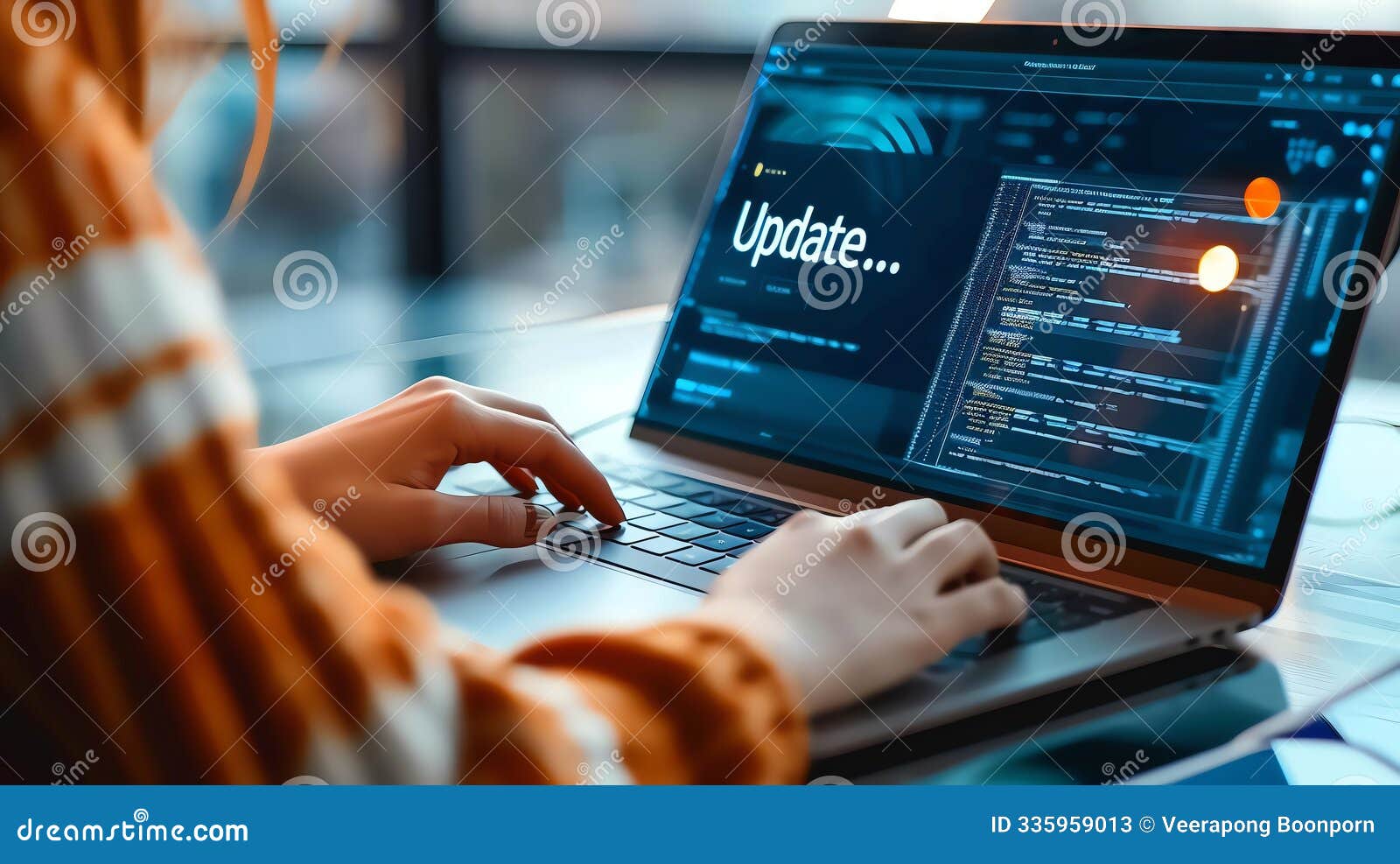 Person Operating Laptop with Updating System Progress on Screen ...