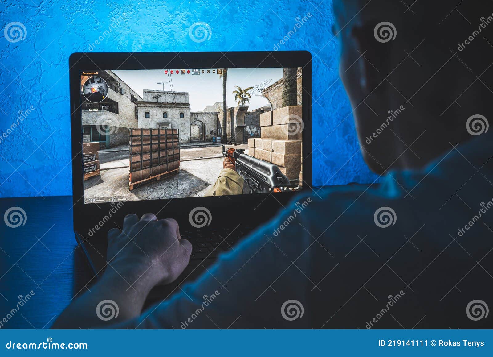 Person Playing Counter Strike Global Offensive Video Game on Computer ...