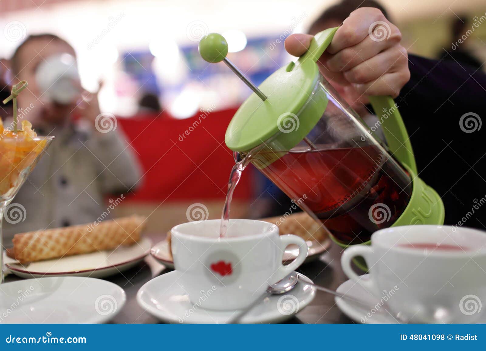 Person pouring fruit tea stock photo. Image of glass - 48041098