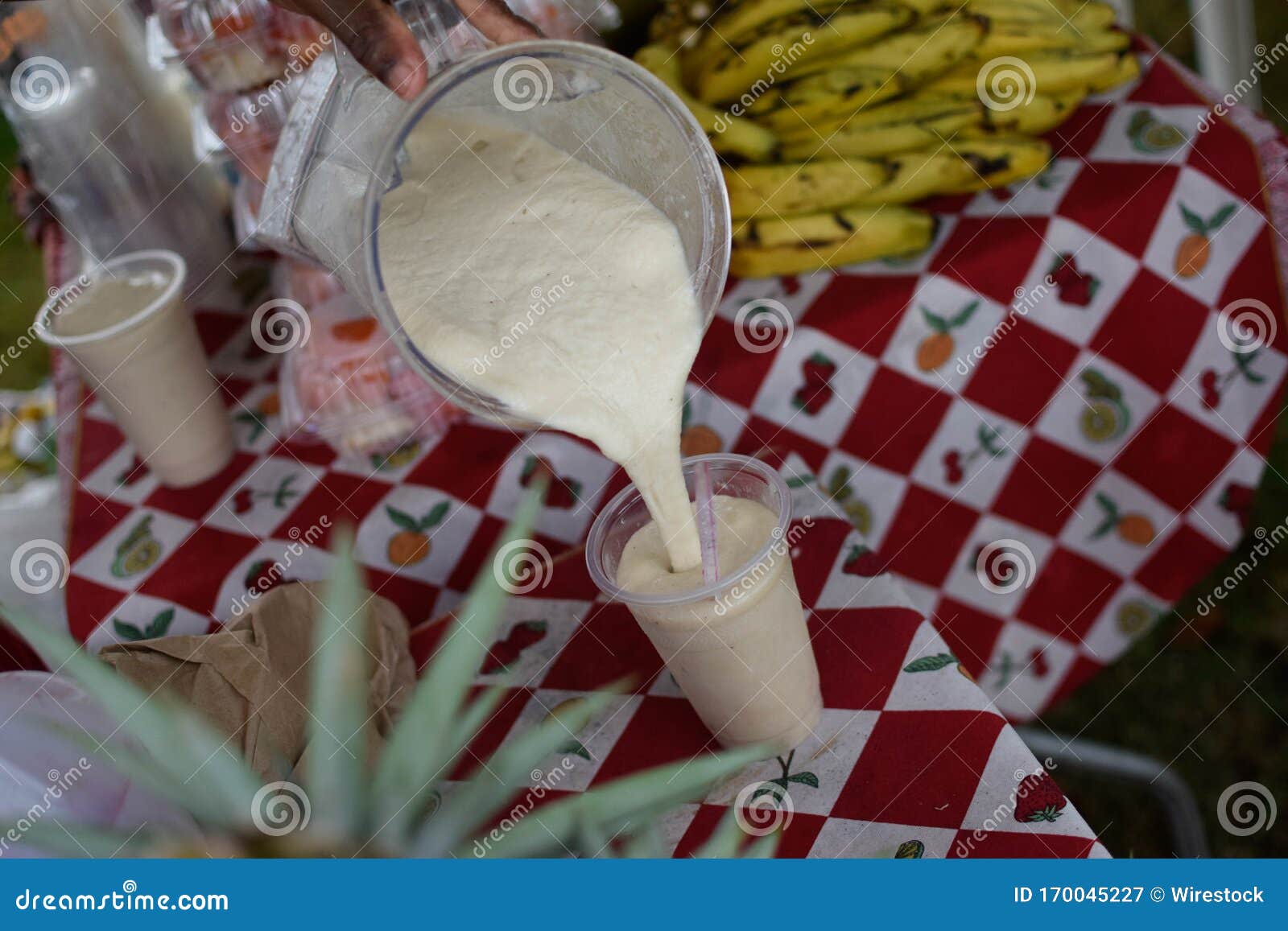 Person Pouring Some Milkshake in a Plastic Cup Stock Image - Image of ...