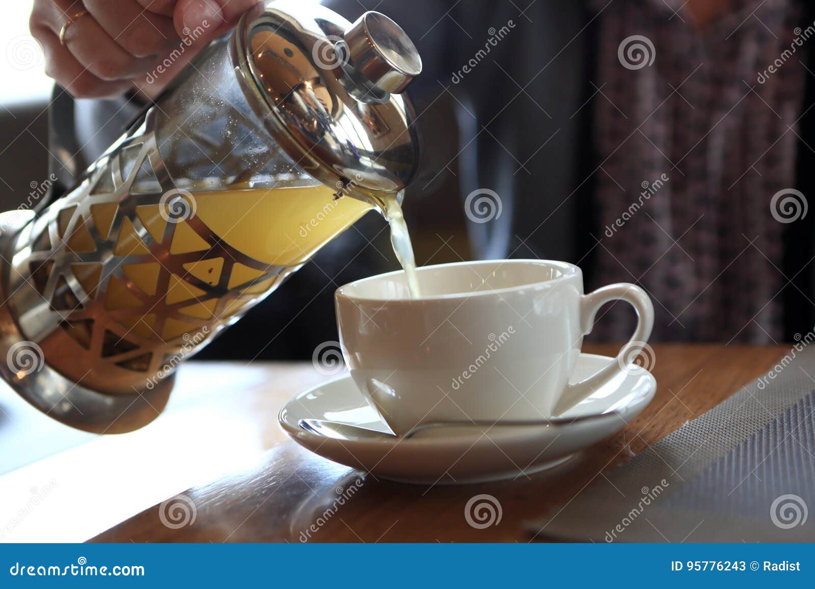 Person pouring tea stock image. Image of home, liquid - 95776243