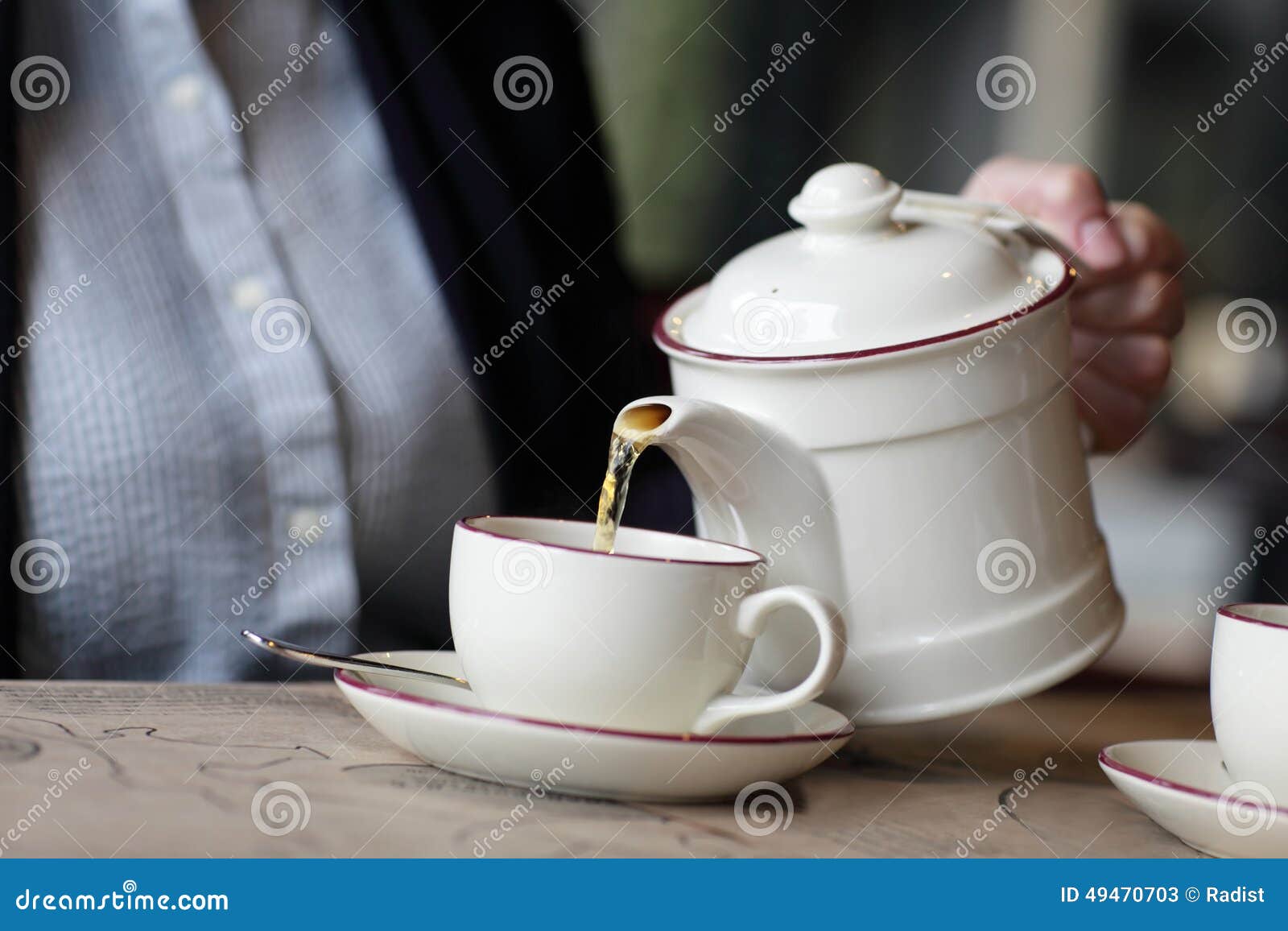 Person pouring tea stock image. Image of hold, brown - 49470703