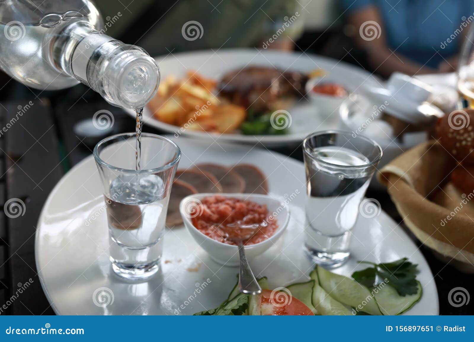 Person Pouring Vodka into Glasses Stock Image - Image of barkeeper ...