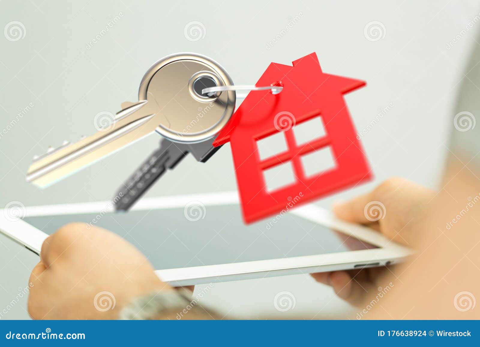 Person Presenting the Virtual Projection of Keys and a House Stock ...