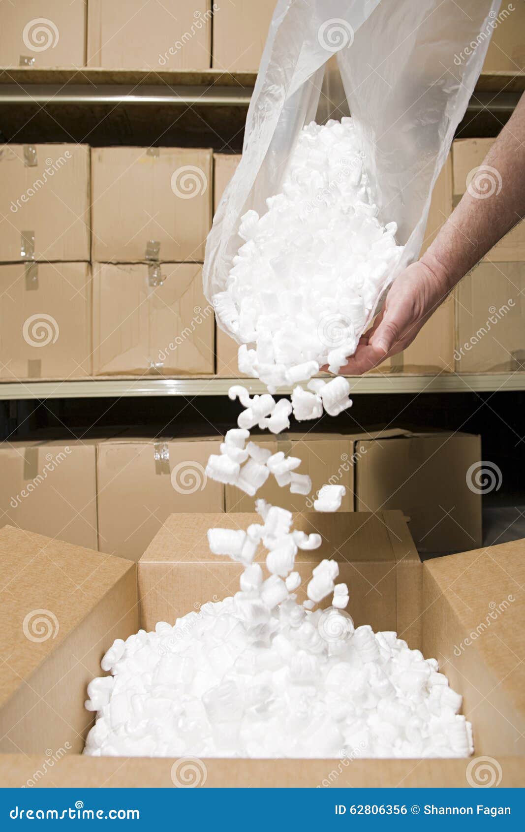 Person Putting Packing Peanuts in Box Stock Photo - Image of plastic ...