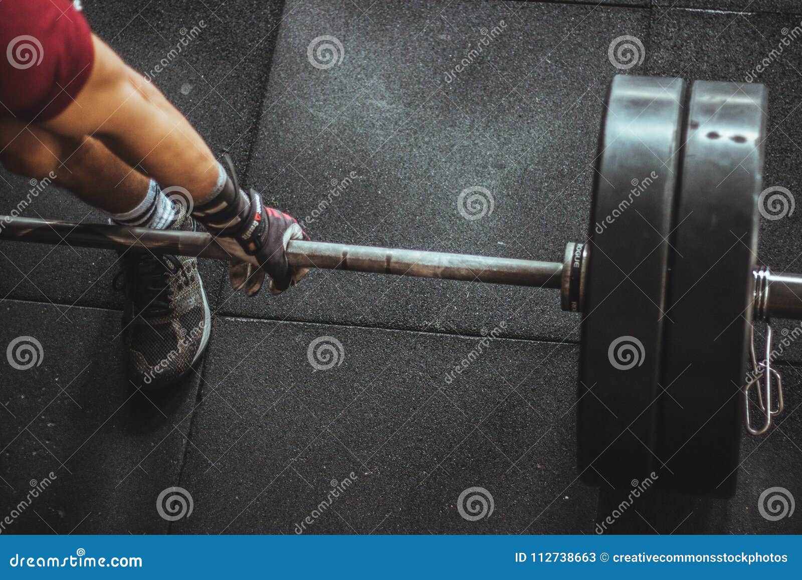 Person In Red Shirt Lifting A Barbell Picture. Image: 112738663