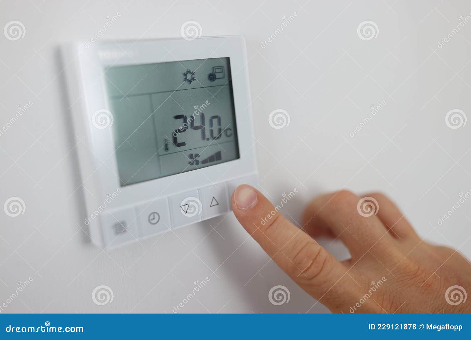 Person Regulates Air Temperature in Room through Remote Control on Wall ...