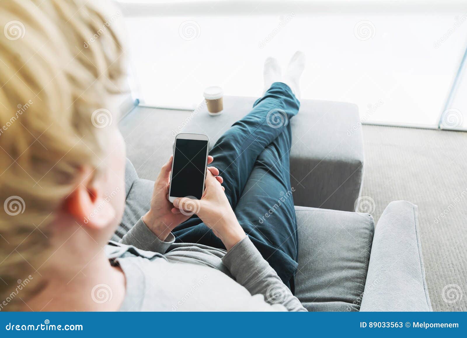 Person Relaxing and Using Smart Phone Stock Image - Image of device ...
