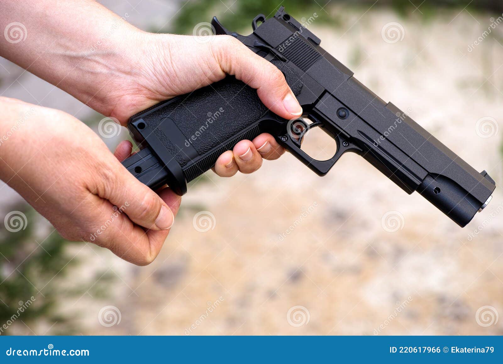 Person Reloading an Airsoft Gun Stock Photo - Image of trigger, round ...