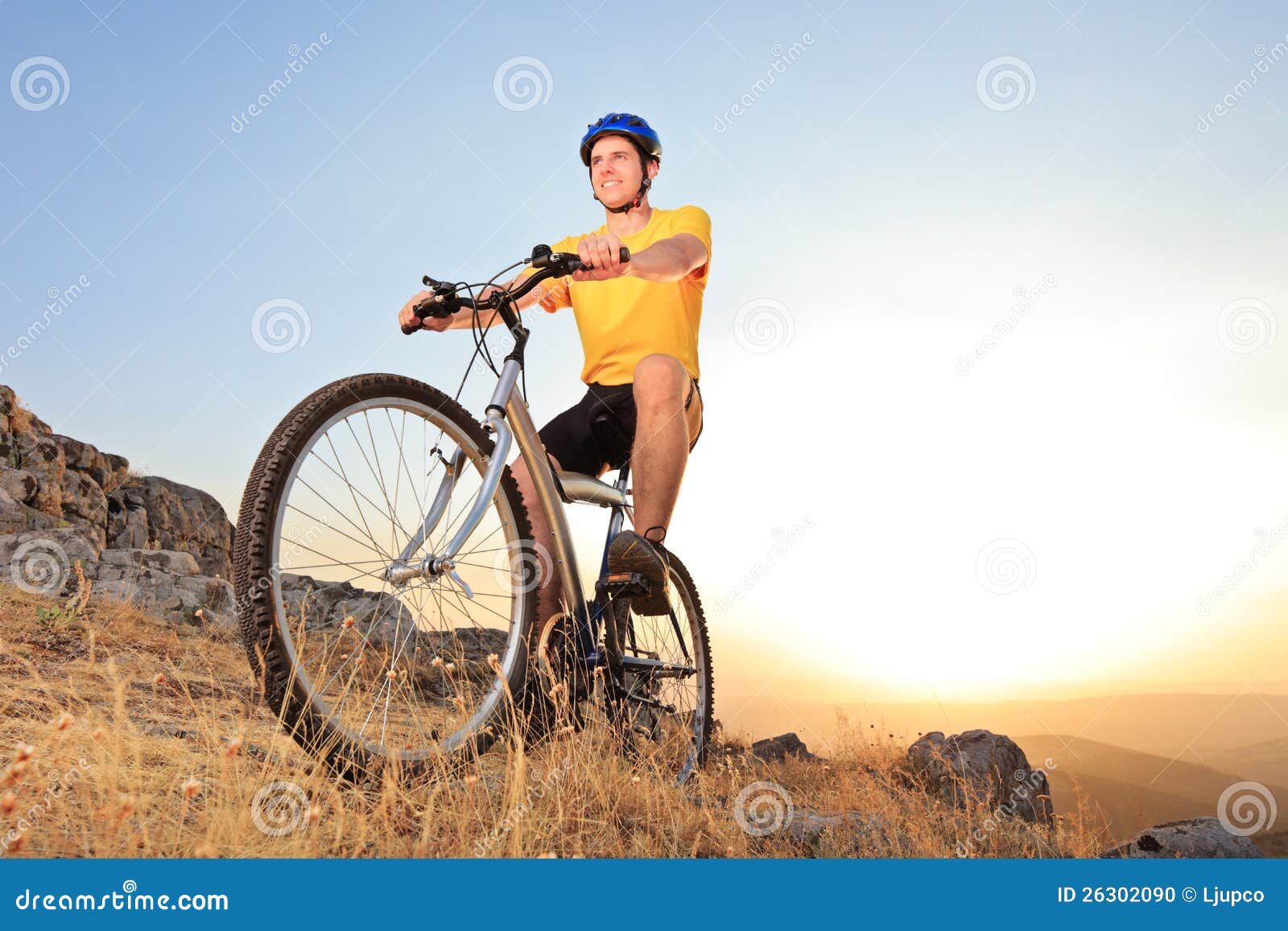 Person Riding a Mountain Bike on a Sunset Stock Photo - Image of helmet ...
