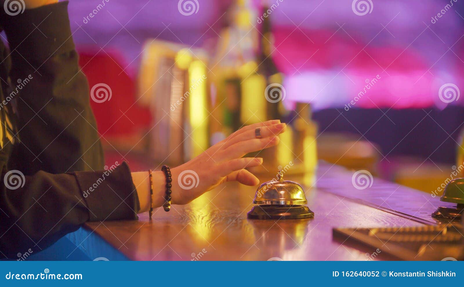 A Person Rings the Bell on the Bartender Stand Stock Photo - Image of ...