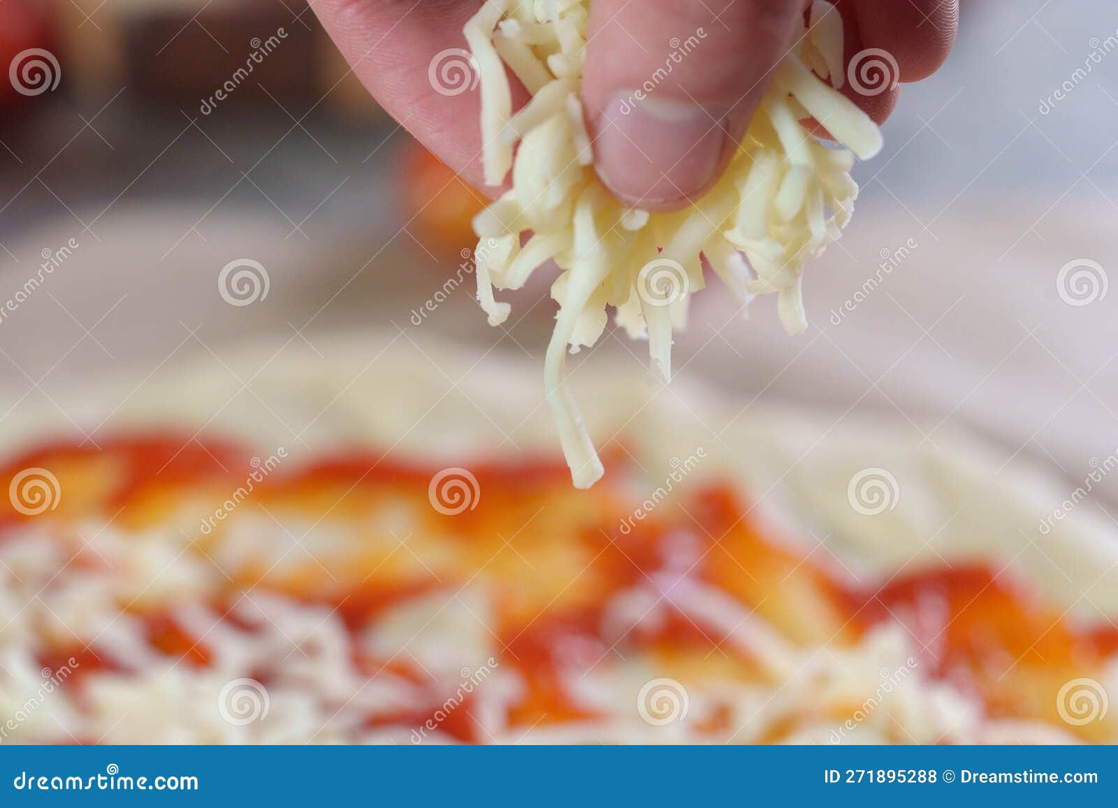 Person S Hand Adding Grated Cheese To Pizza, Process of Making Pizza ...