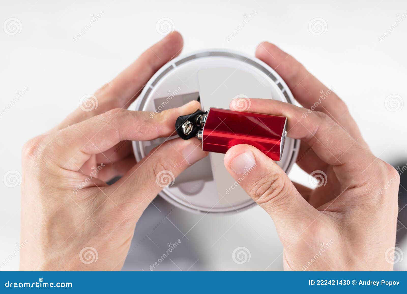 Person`s Hand Inserting Battery in Smoke Detector Stock Photo - Image ...