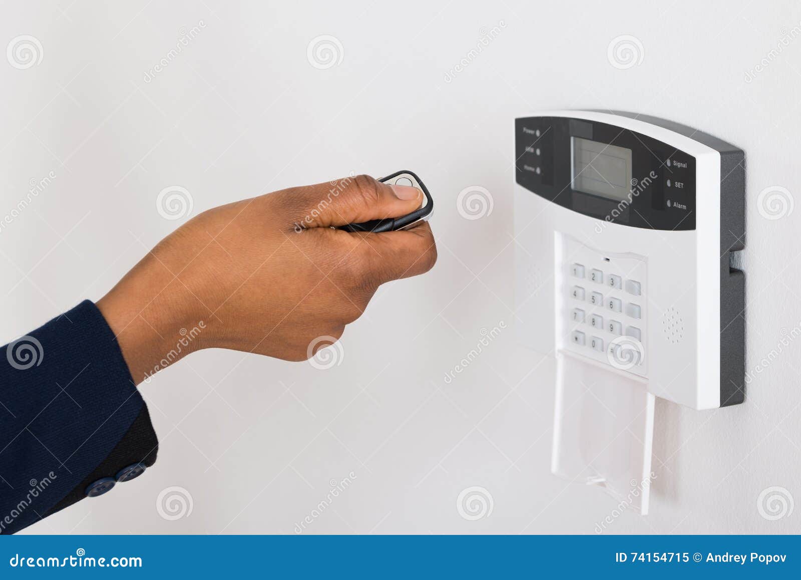 Person S Hand Operating Entrance Security System with Remote Stock ...