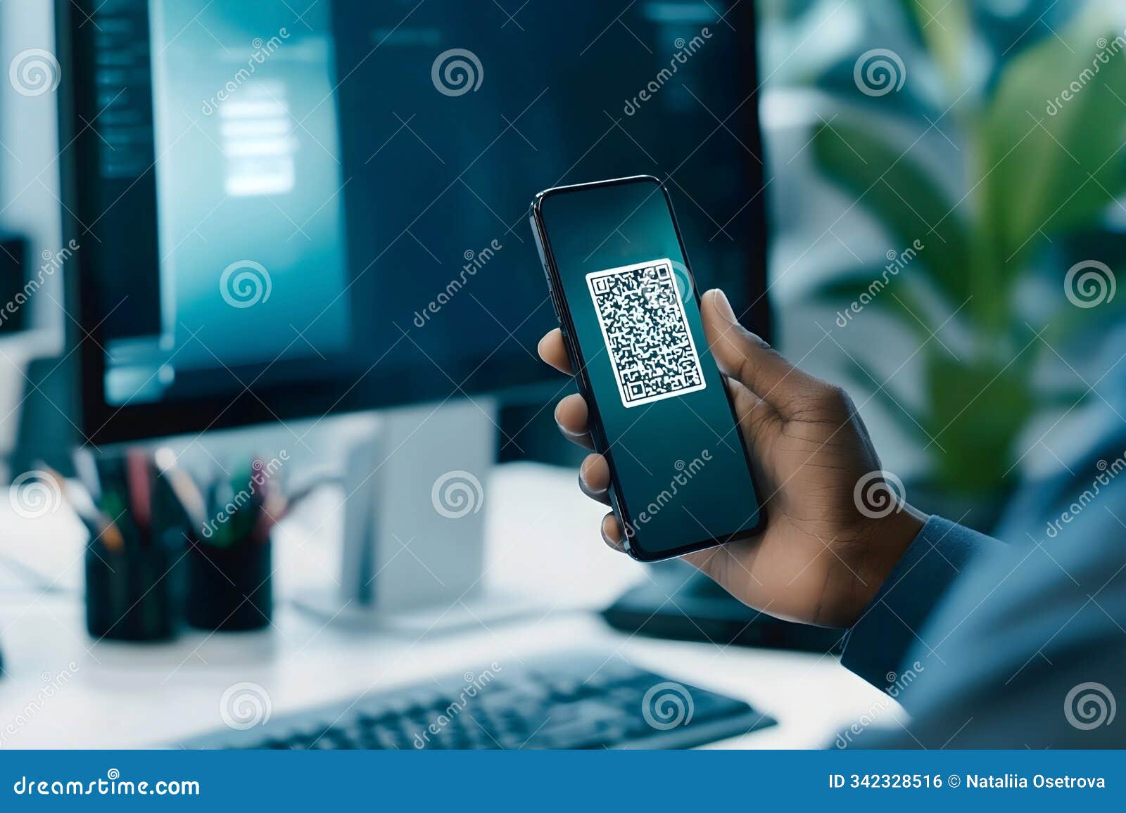 Person Scanning a QR Code on a Smartphone in an Office Setting with a ...