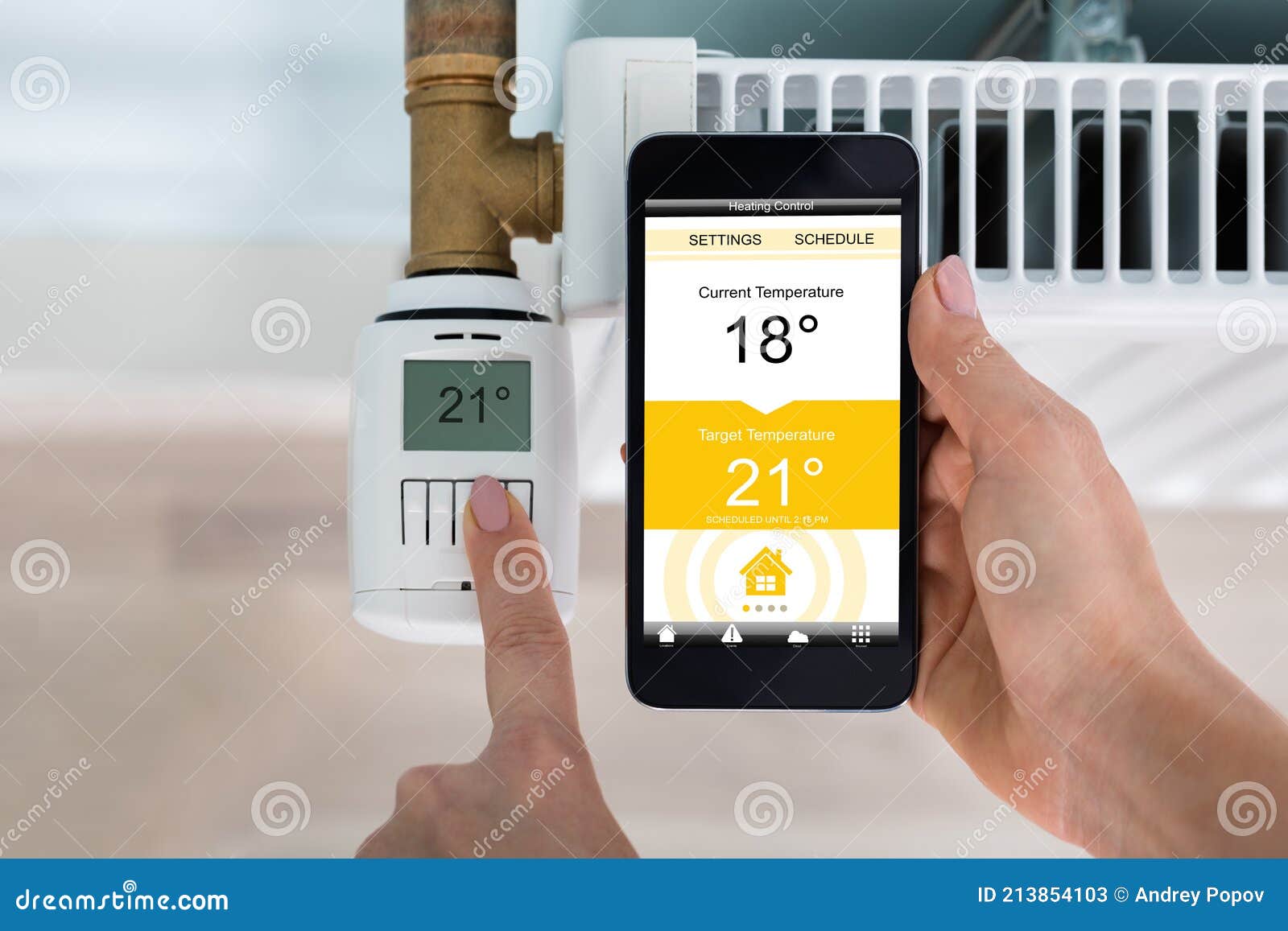 Person Setting Temperature of Thermostat Using Mobilephone Stock Image ...