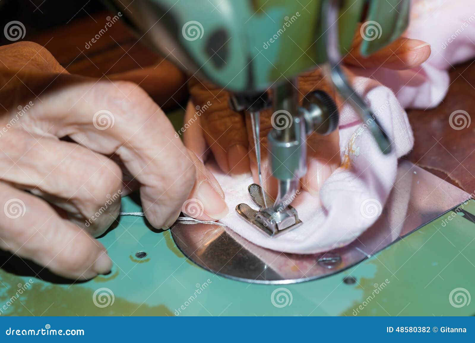 Person sewing machine stock photo. Image of machine, hands - 48580382