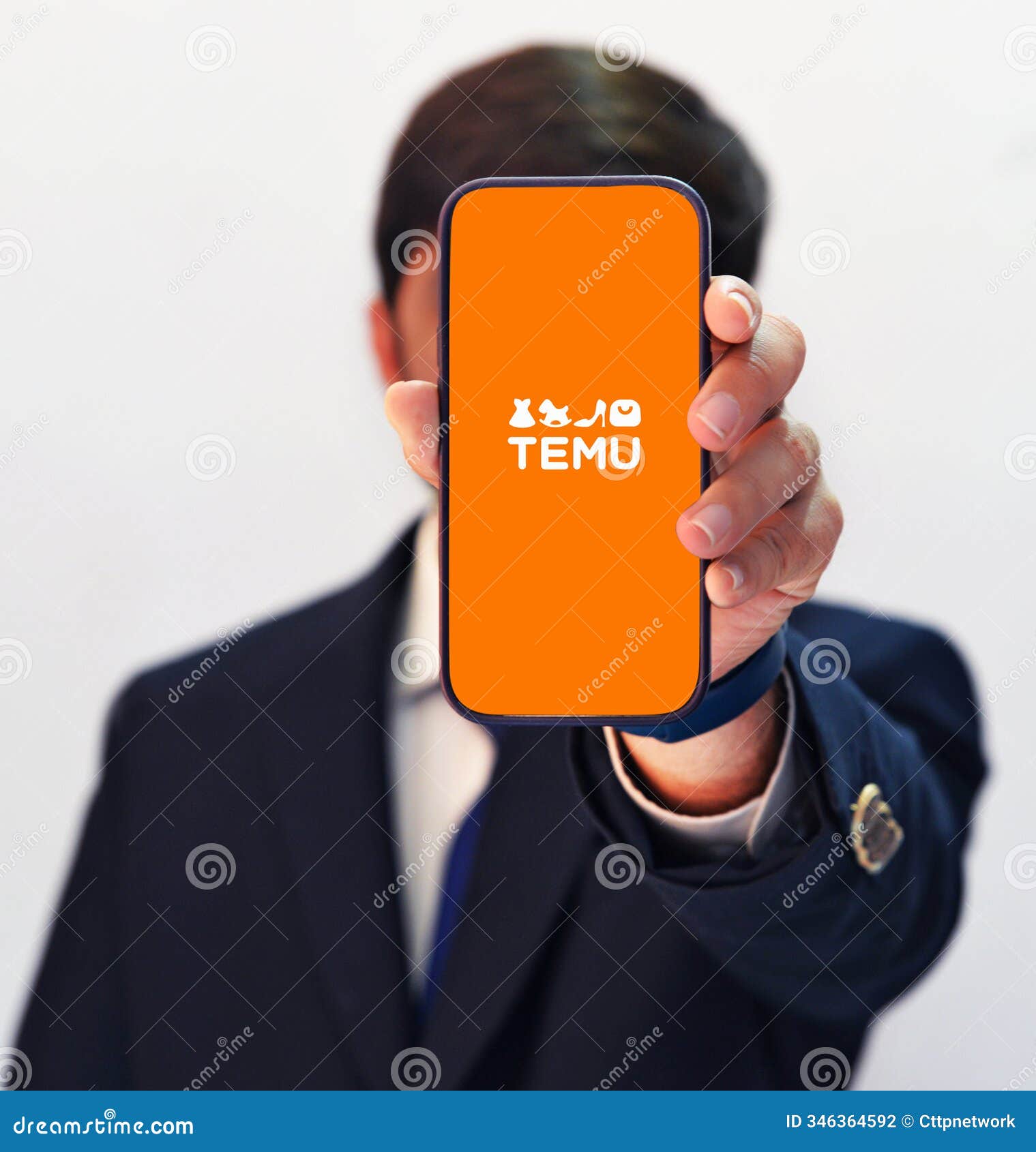 Person Showing Temu Ecommerce Application on Mobile Screen ...