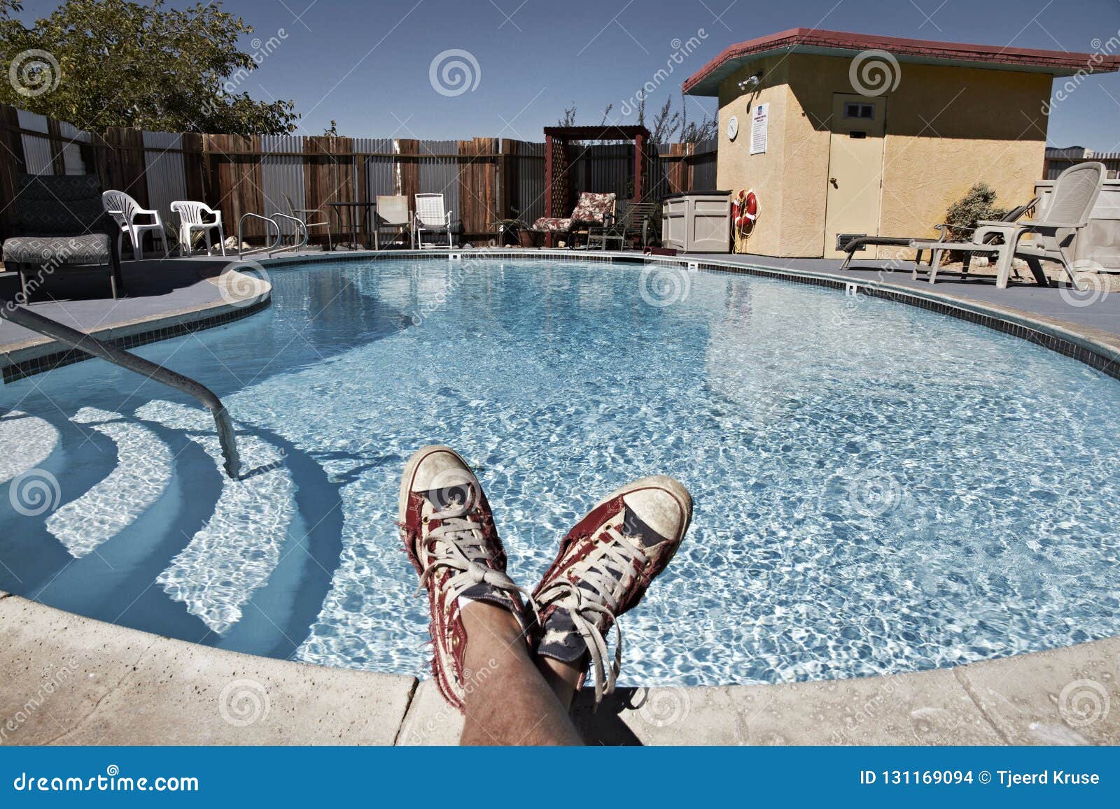 Person Sitting on the Edge of a Swimmingpool Stock Photo - Image of ...