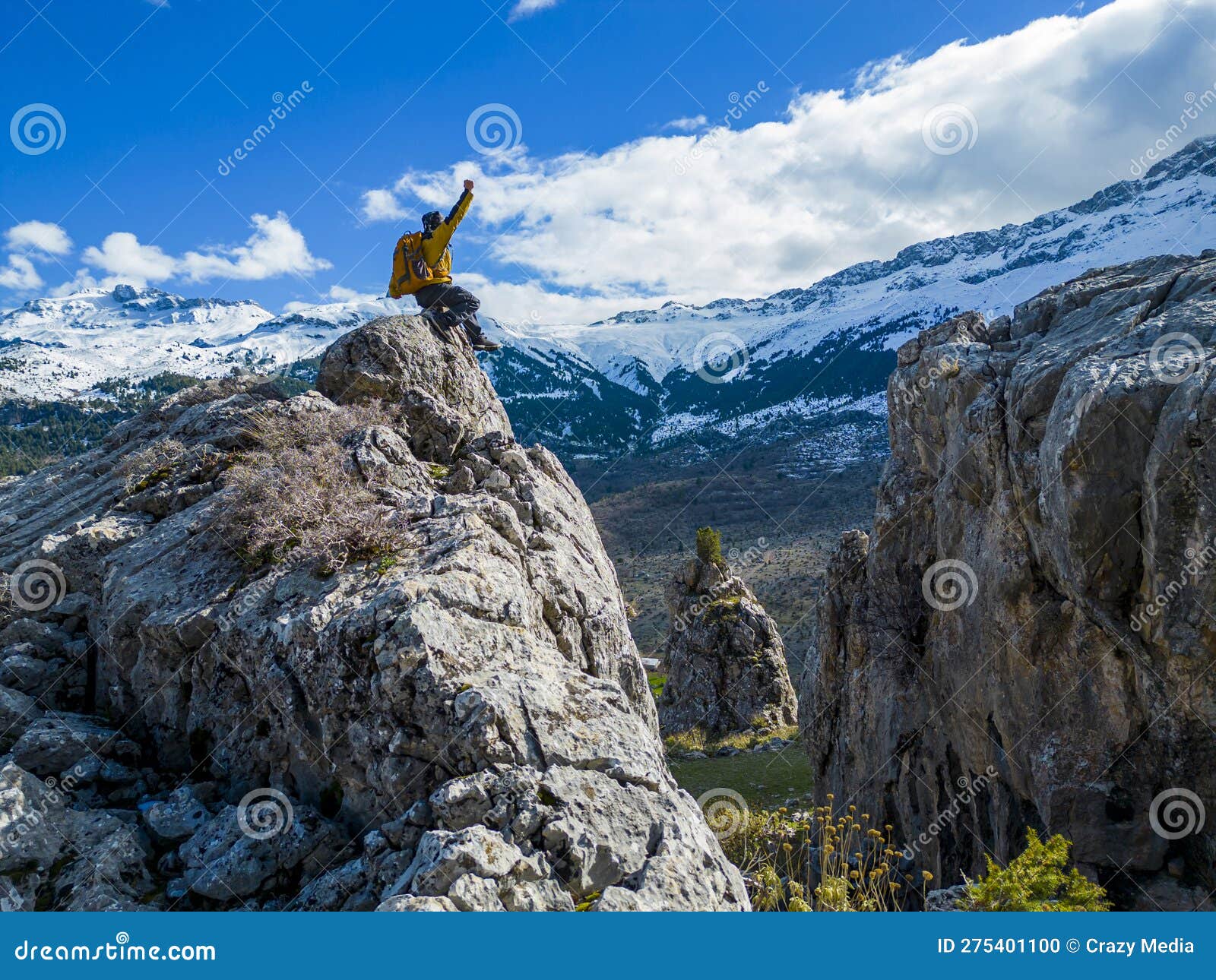 Person Sitting at the Far End of the Cliff and Watching the View Stock ...