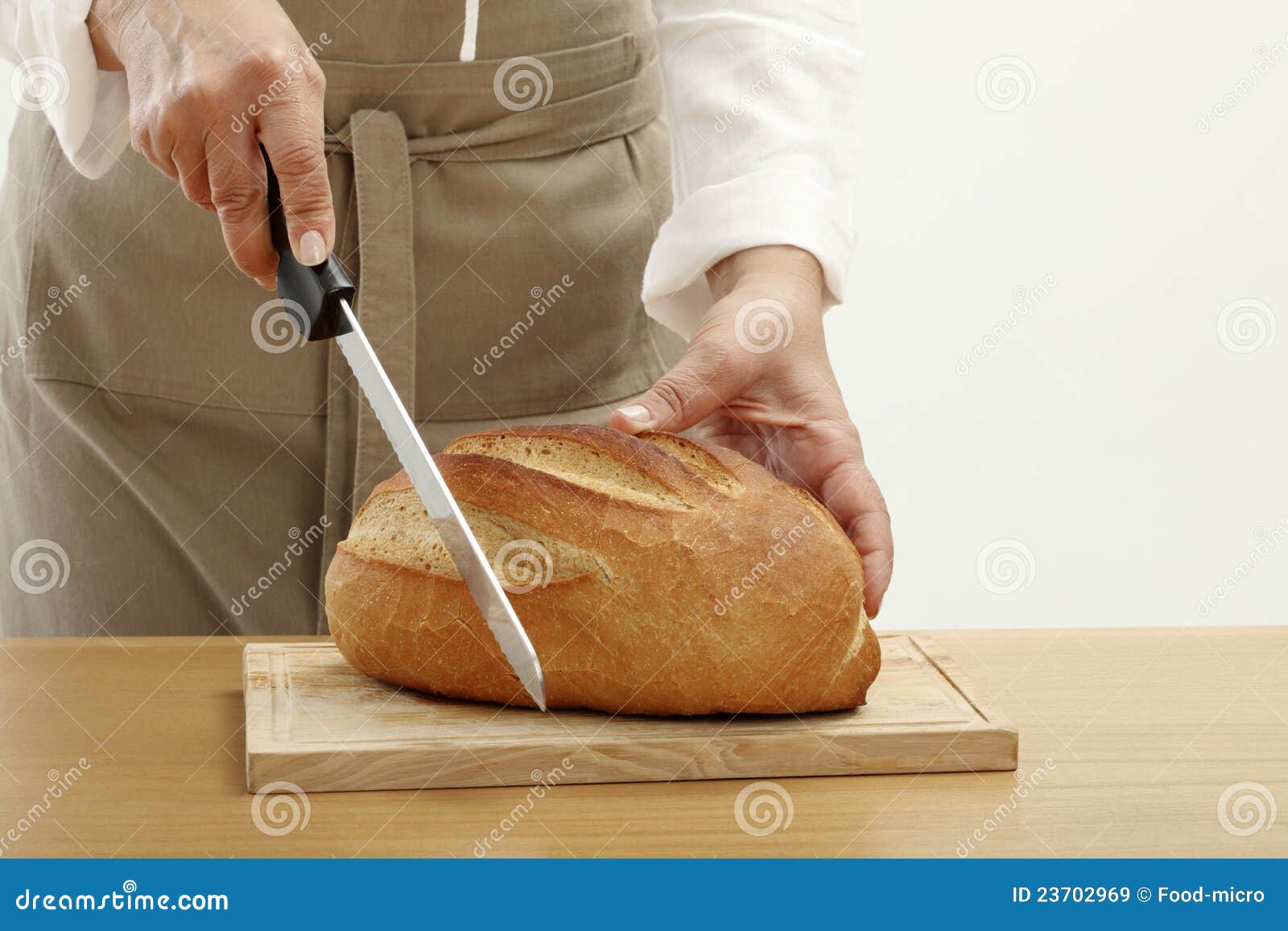 Person Slicing a Loaf of Bread Stock Image - Image of classical, razor ...