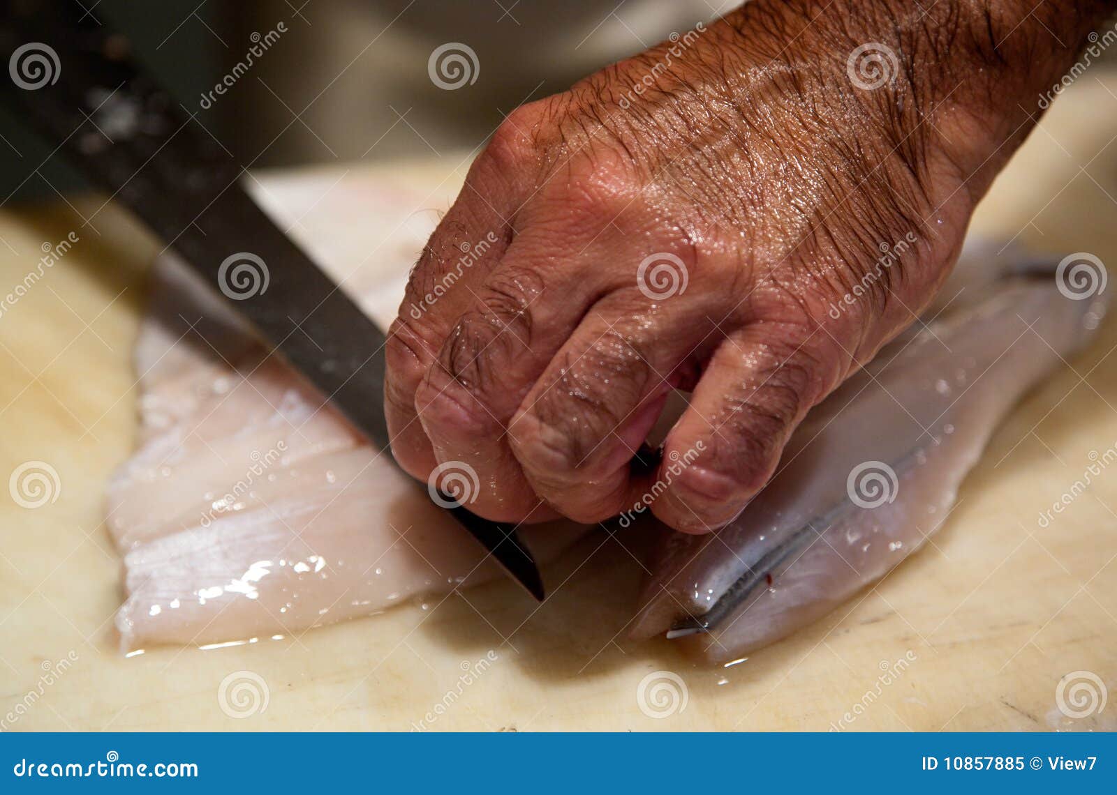 Person slicing raw fish stock image. Image of filleting - 10857885