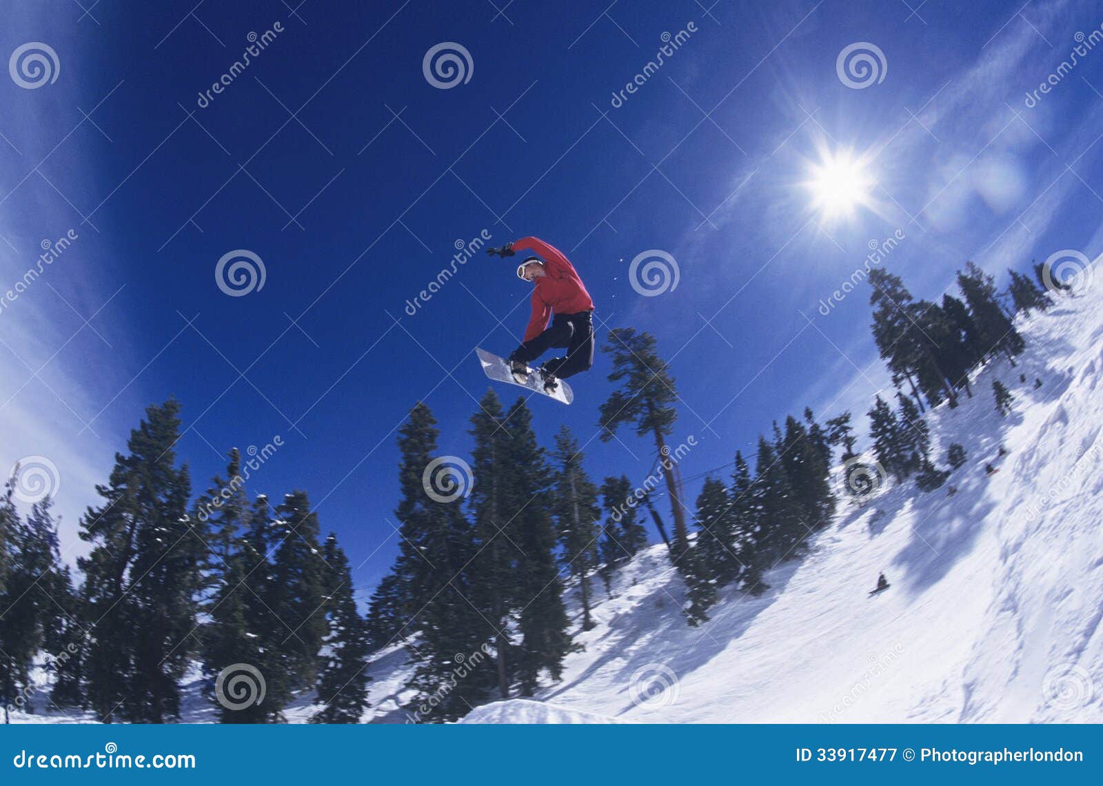 Person on Snowboard Jumping Midair Imagen de archivo - Imagen de ...