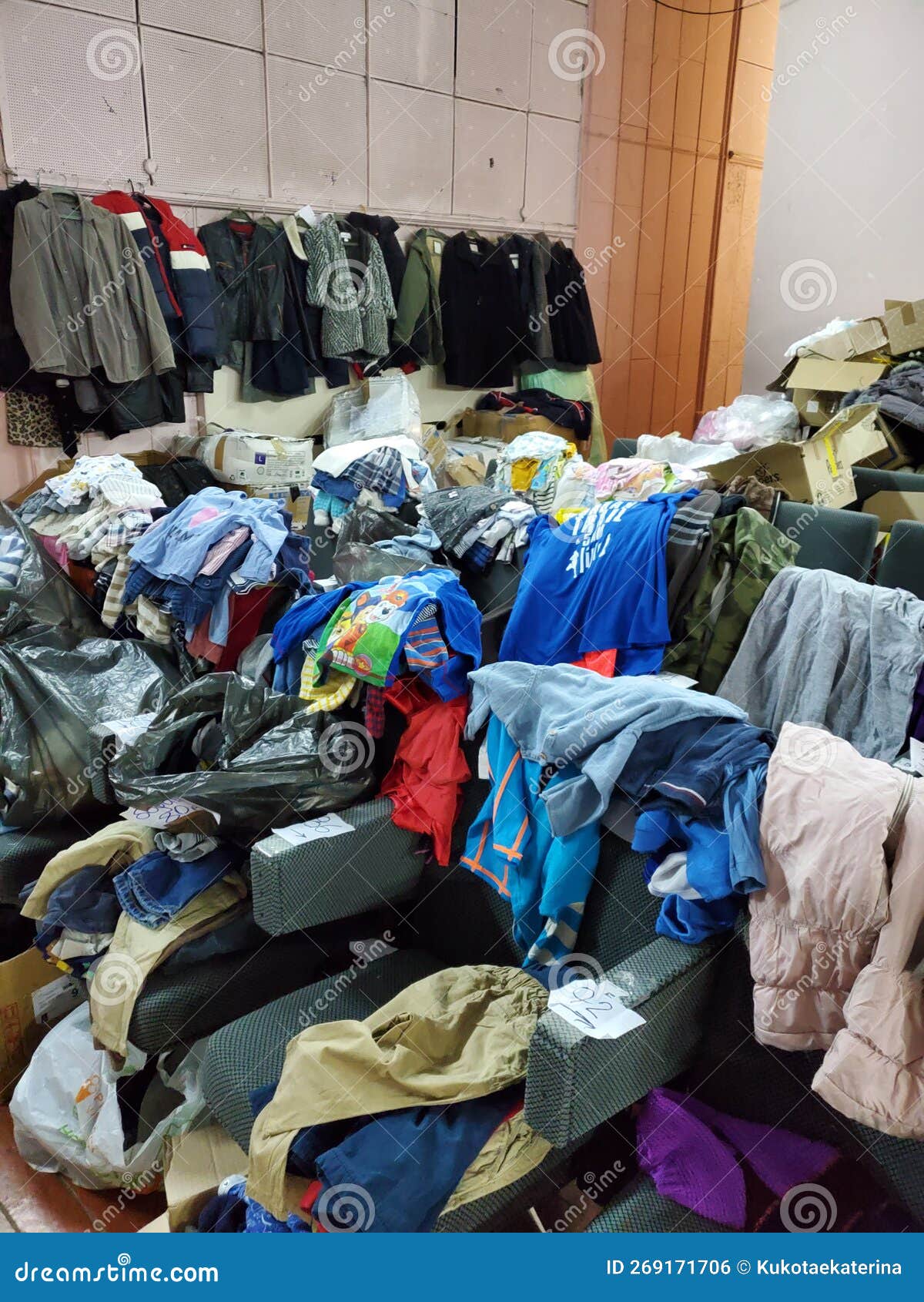 Person Sorting Second Hand Clothes by Size and Gender Stock Photo ... Person Sorting Second Hand Clothes by Size and Gender Stock Photo ...