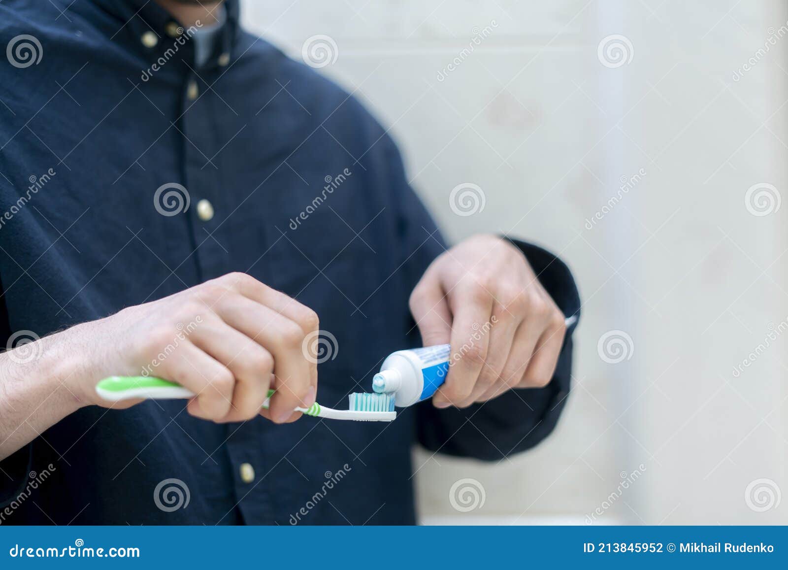 A Person Squeeze Toothpaste on a Toothbrush in Bathroom Stock Photo ...