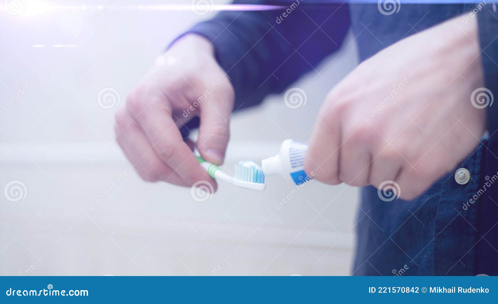 A Person Squeeze Toothpaste on a Toothbrush in Bathroom Stock Photo ...