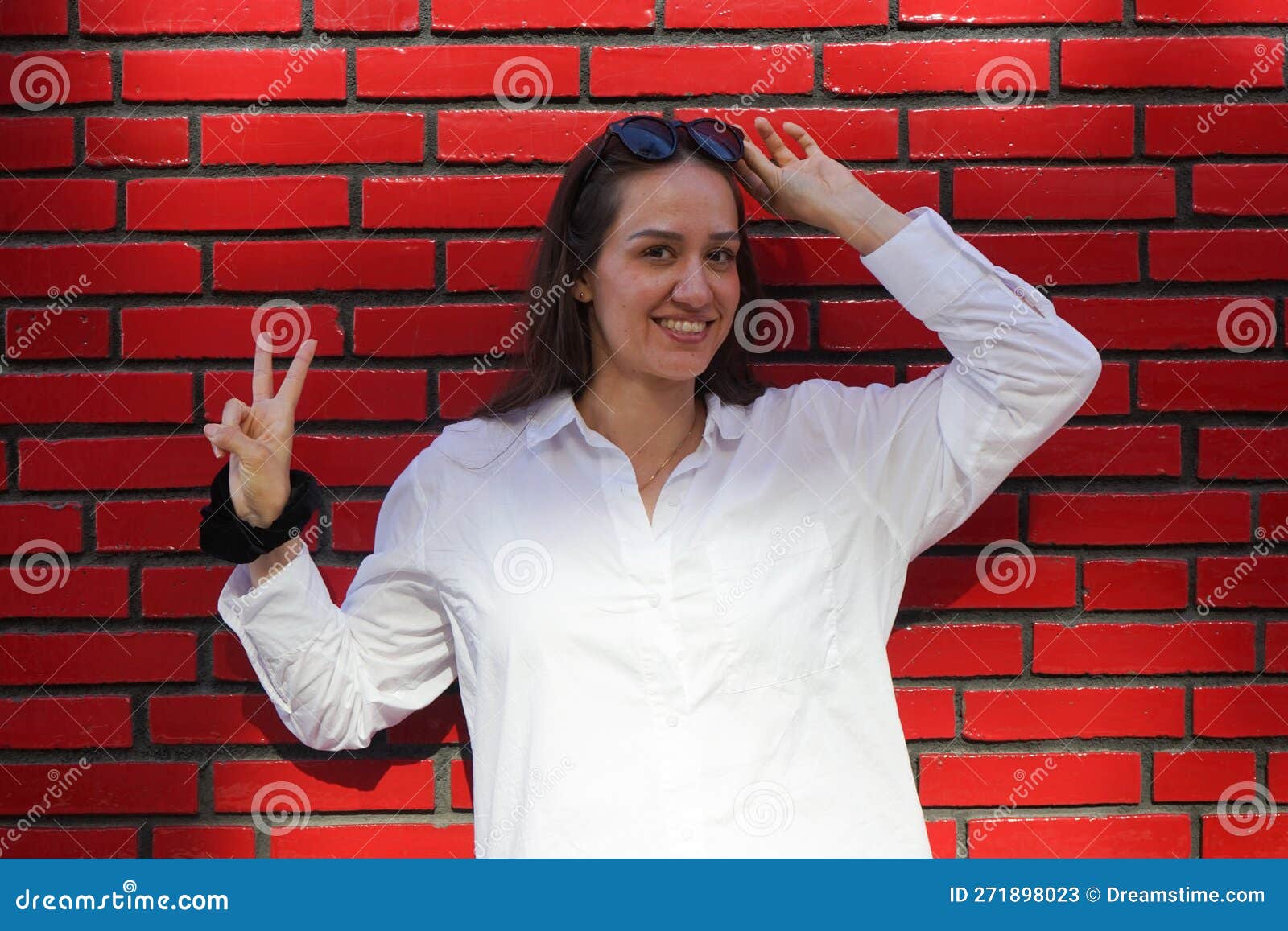 A Person Standing in Front of a Brick Wall Stock Image - Image of ...