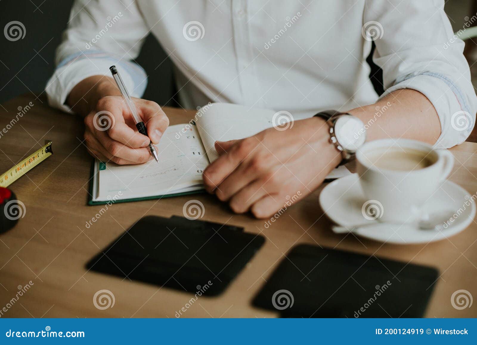 Person Taking Notes in a Notebook while Working from Home Stock Image ...