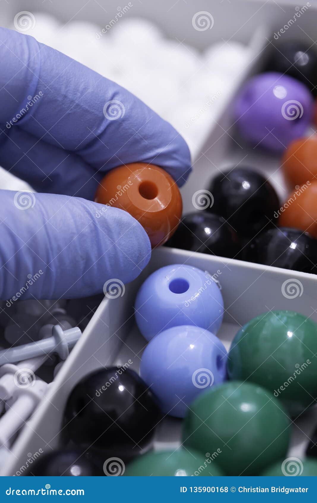 Person Taking an Oxygen Molecule from a Molecular Model Kit Stock Photo ...
