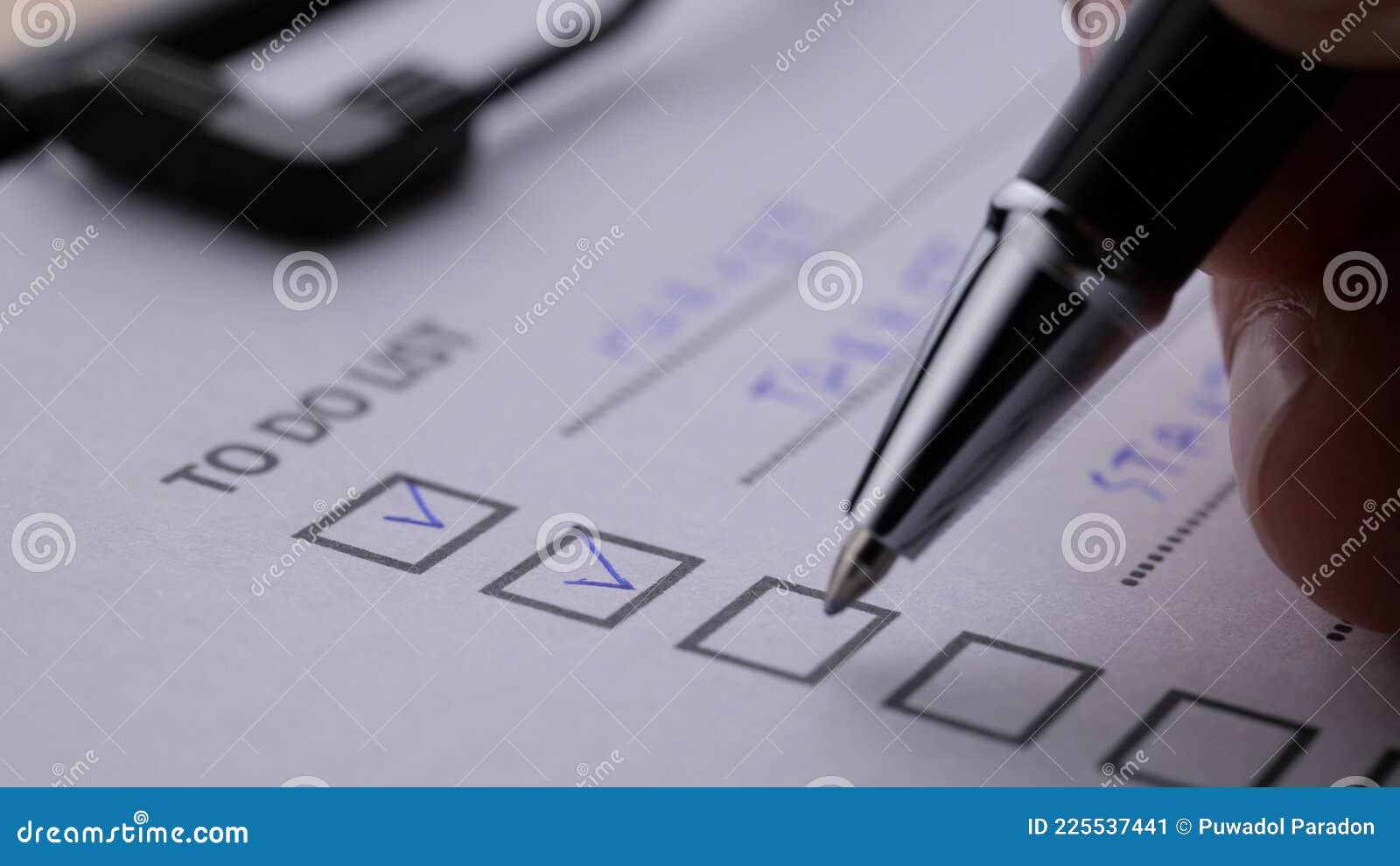 The Person Ticks Checkbox Marks with a Pen, Filling Up a To-Do List ...