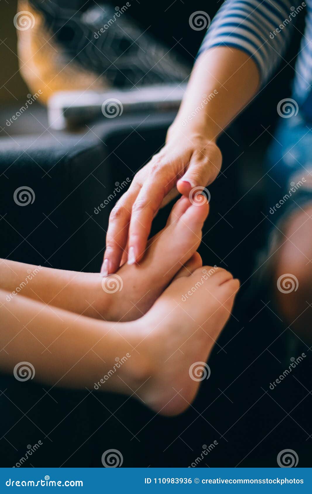 Person Touching Child's Feet Picture. Image: 110983936