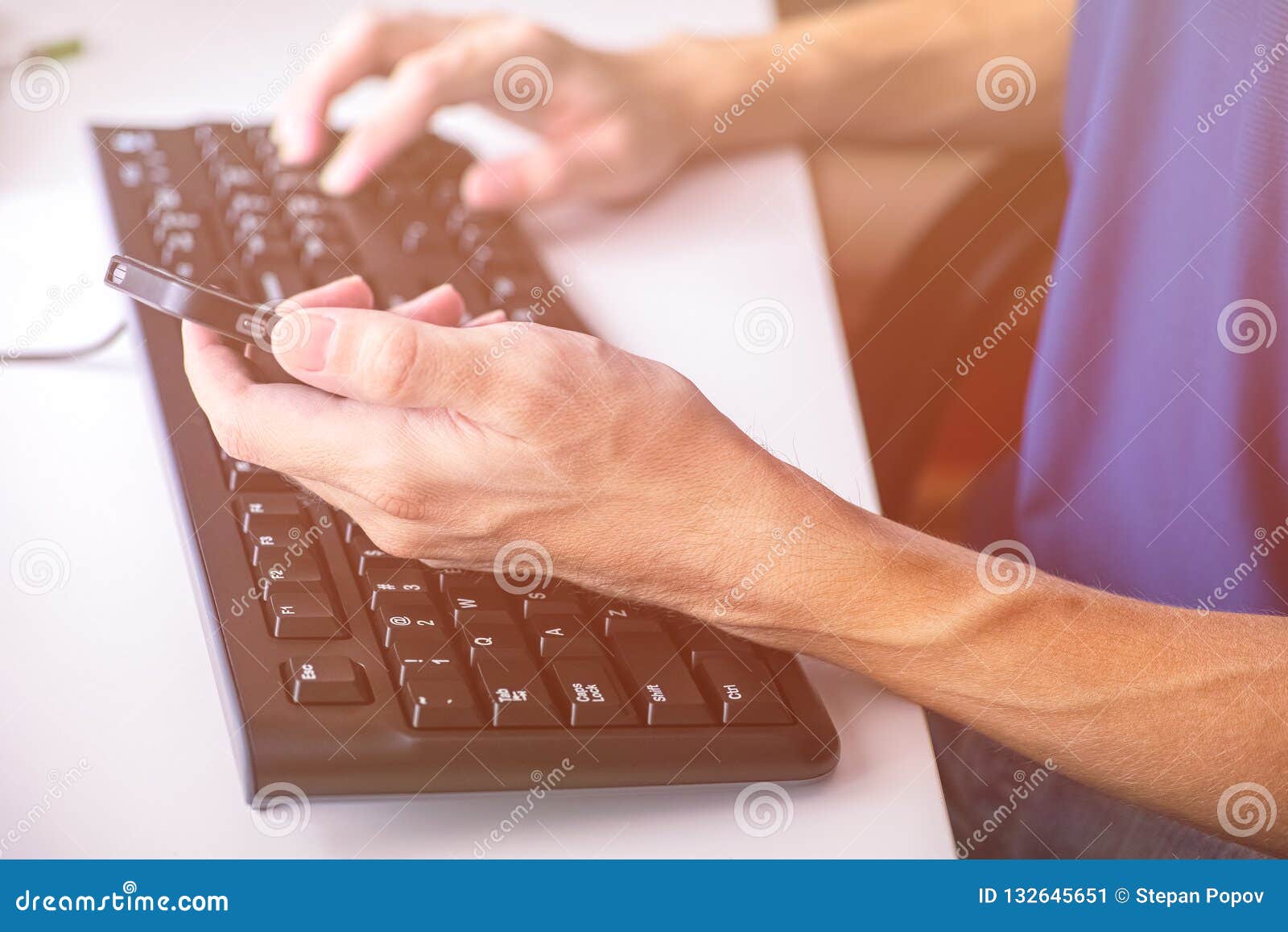 Person Typing on Keyboard and Using Smartphone Stock Image - Image of ...