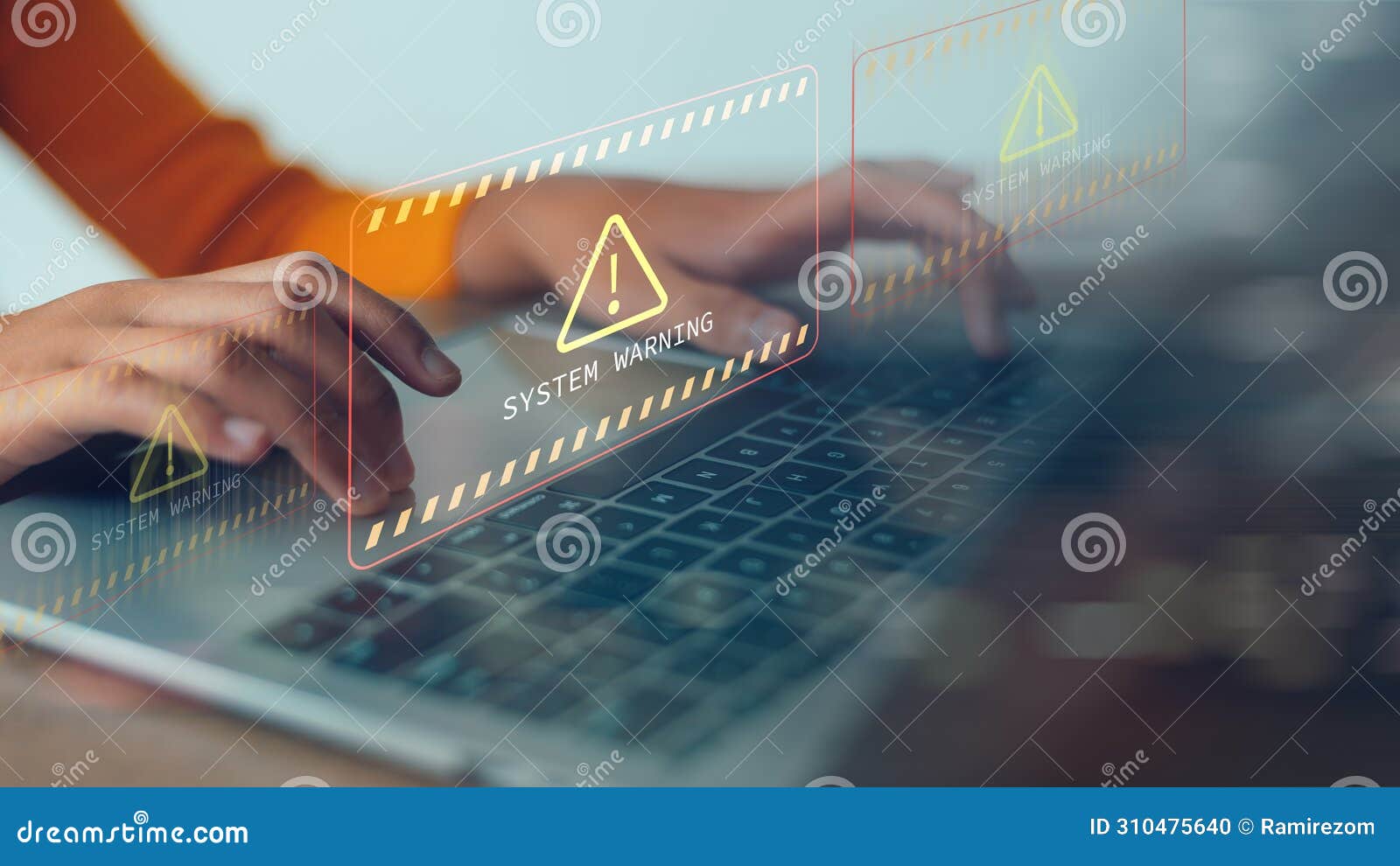 A Person is Typing on a Laptop with a Warning Sign on the Screen Stock ...