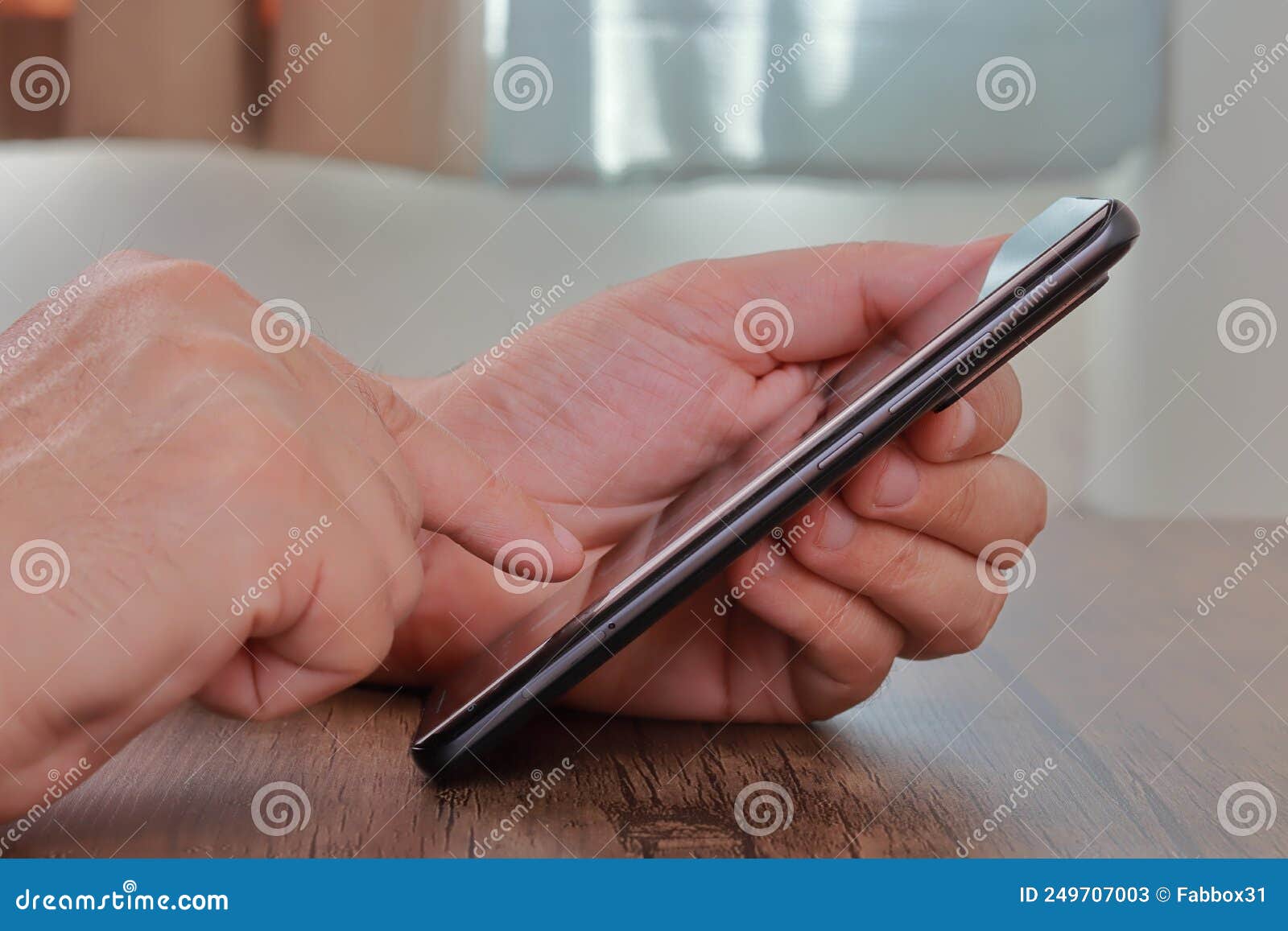 A Man Using His Smartphone at His Desk. Stock Image - Image of ...