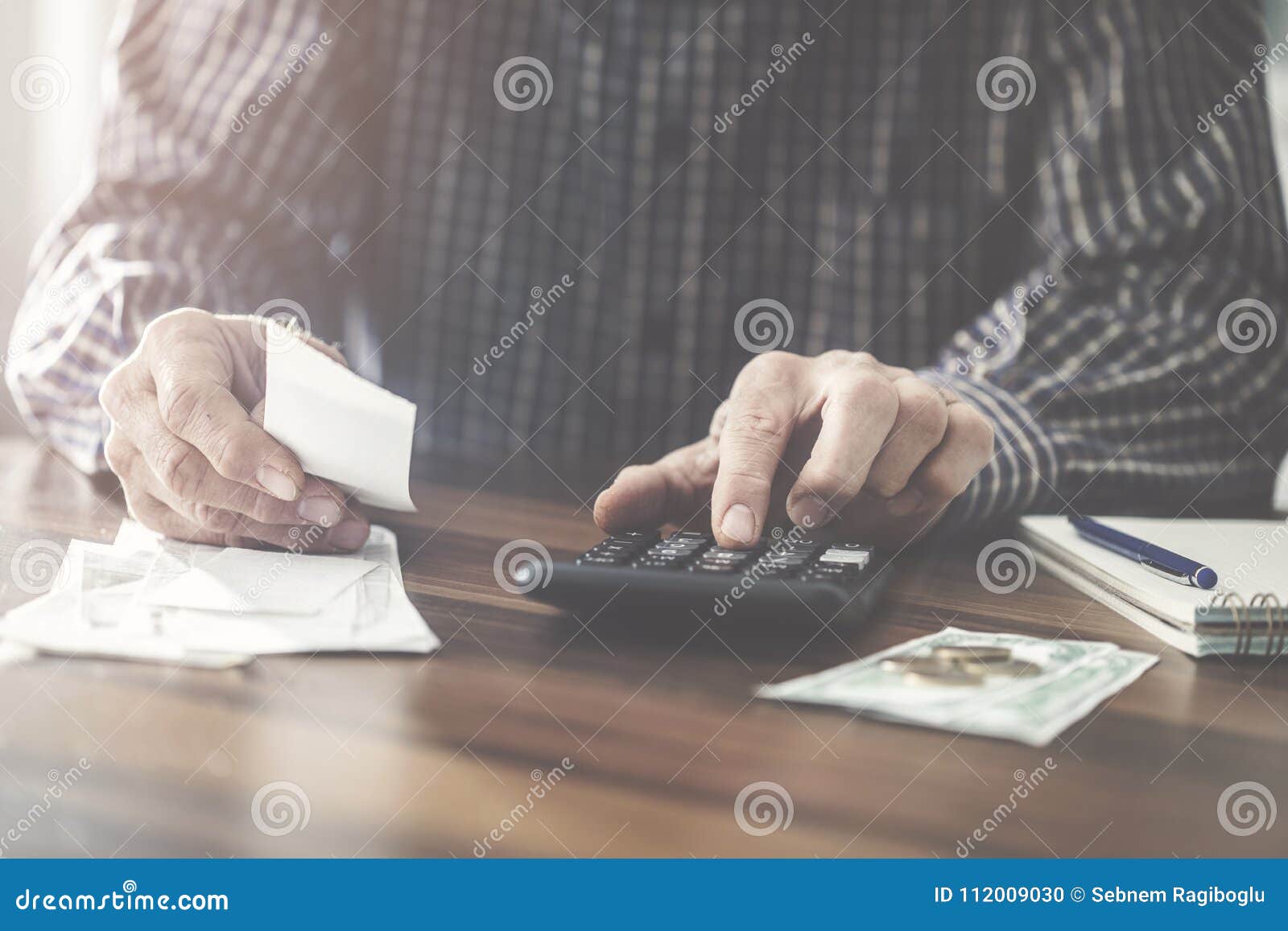 Person Using Calculator and Counting Bills Stock Photo - Image of ...