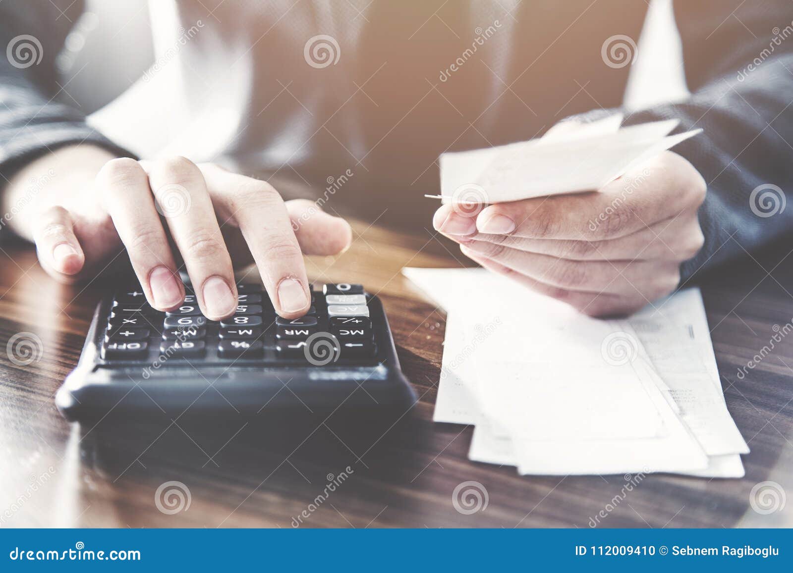 Person Using Calculator and Counting Bills Stock Photo - Image of ...