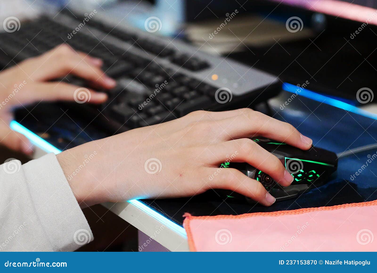 A Person Using a Computer Mouse, a Person Playing a Game on a Desktop ...