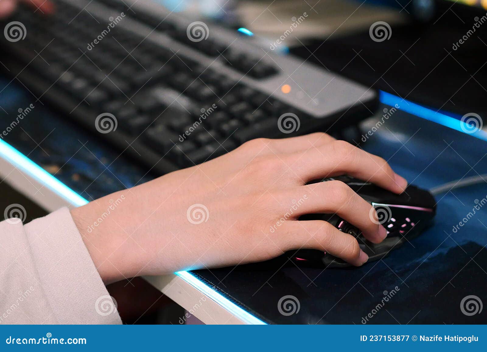 A Person Using a Computer Mouse, a Person Playing a Game on a Desktop ...