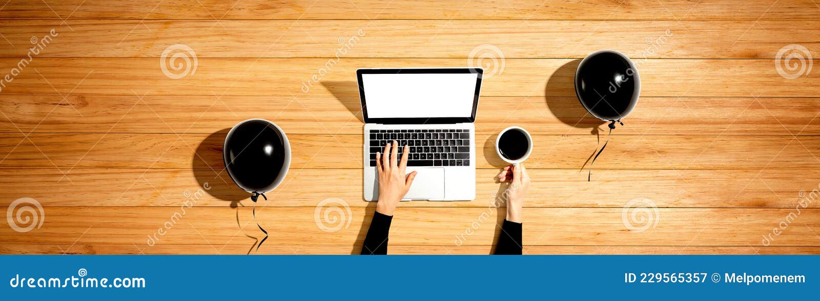 Person Using a Laptop Computer with Black Balloons Stock Image - Image ...