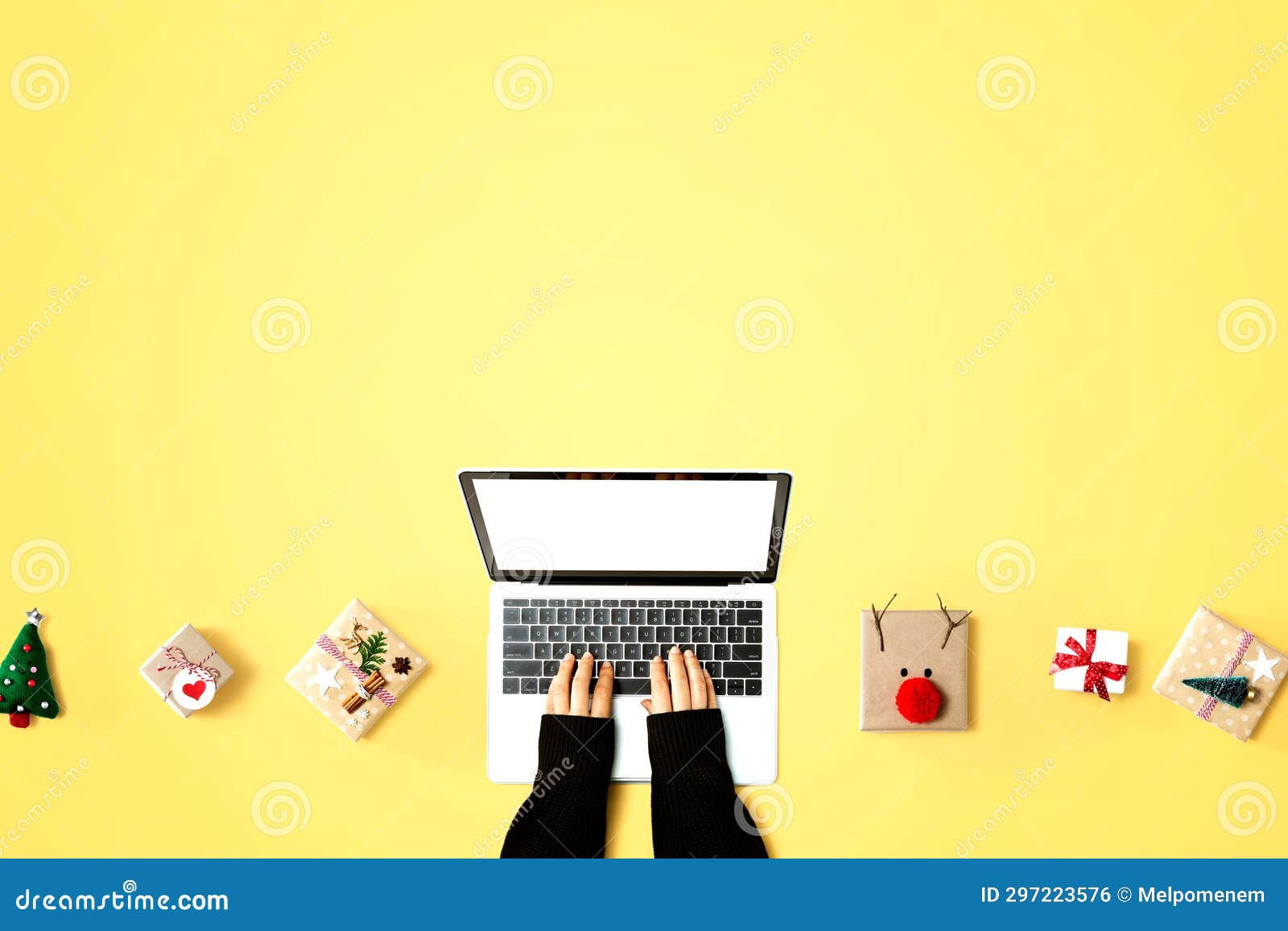 Person Using a Laptop Computer with Christmas Gift Boxes Stock Photo ...