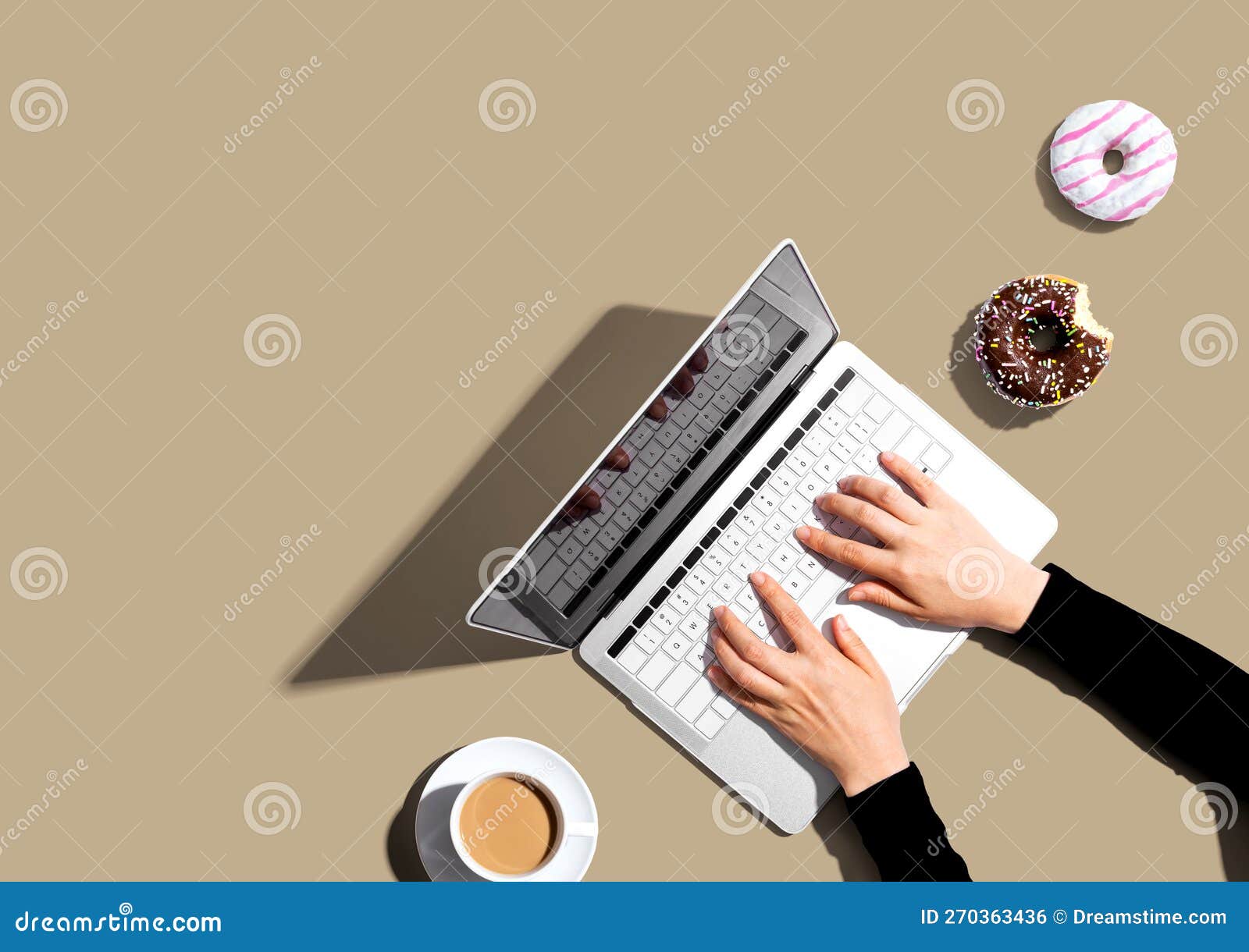 Person Using a Laptop Computer with a Donut and a Cup of Coffee Stock ...