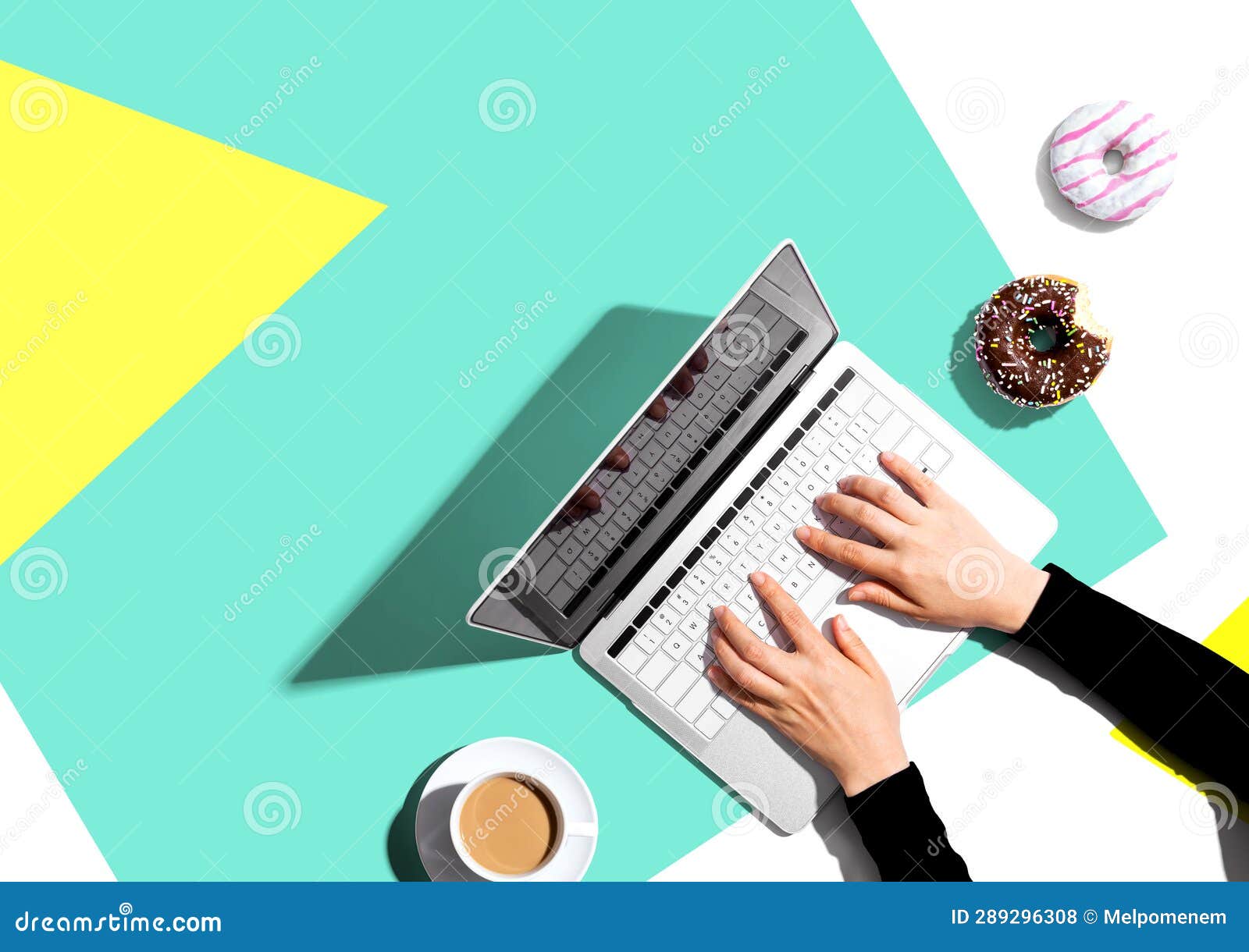 Person Using a Laptop Computer with a Donut and a Cup of Coffee Stock ...