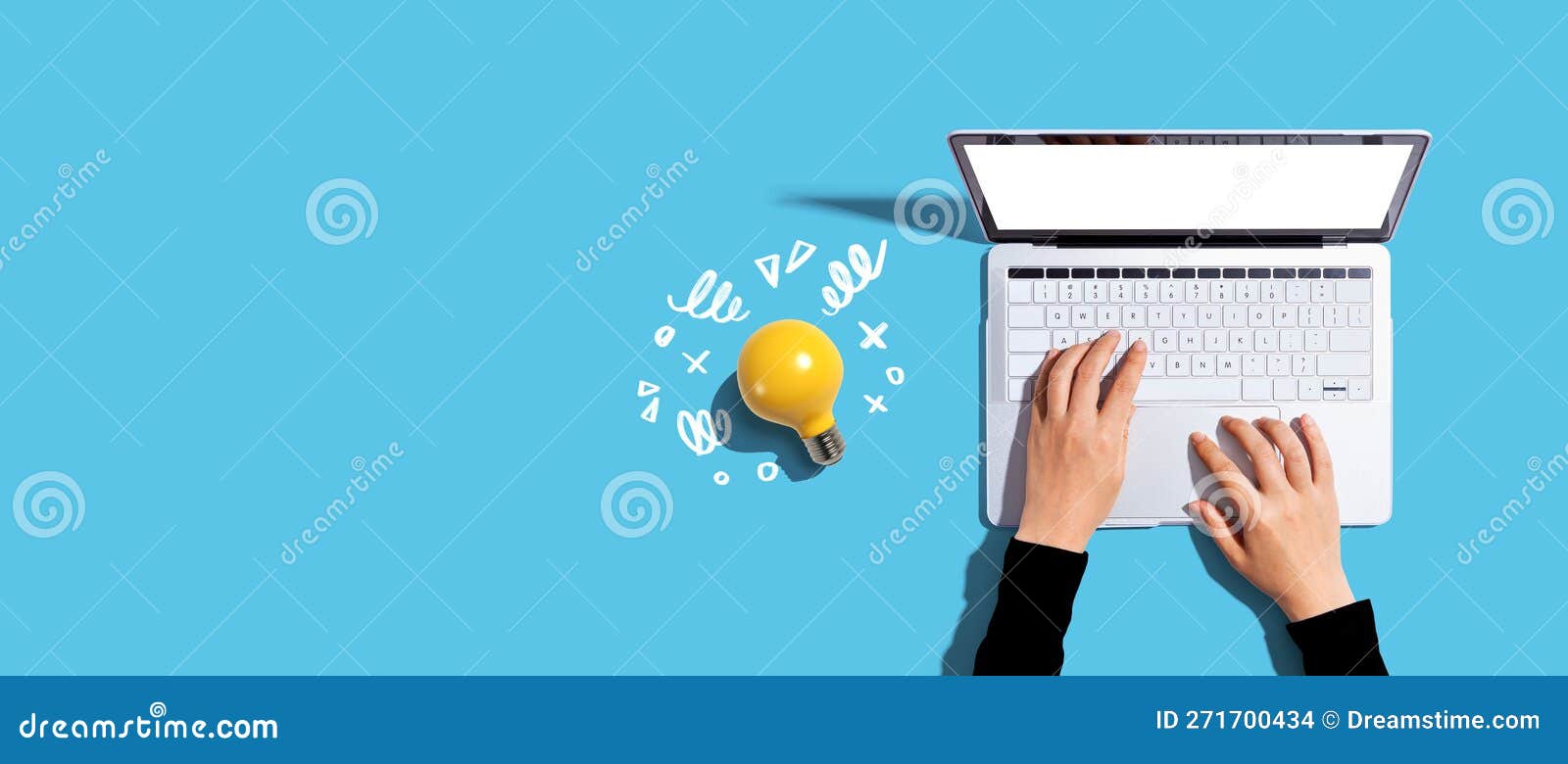 Person Using a Laptop Computer and a Light Bulb Stock Photo - Image of ...