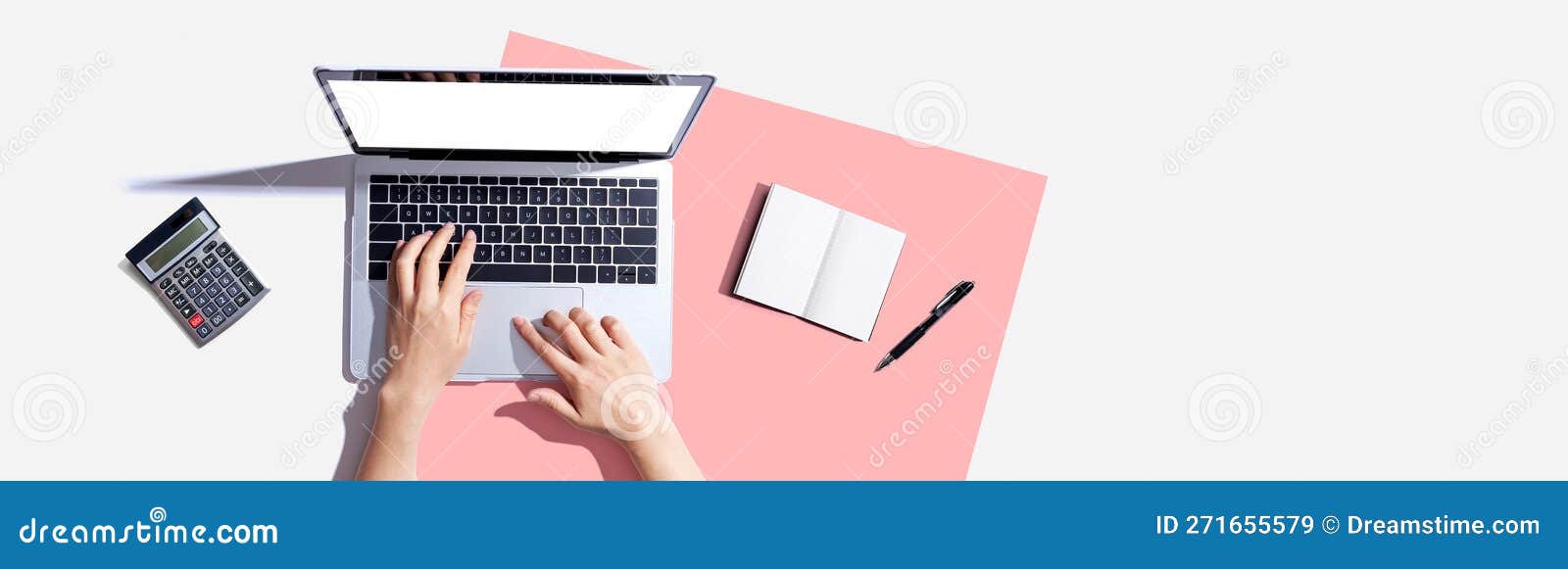 Person Using a Laptop Computer with a Notebook Stock Image - Image of ...