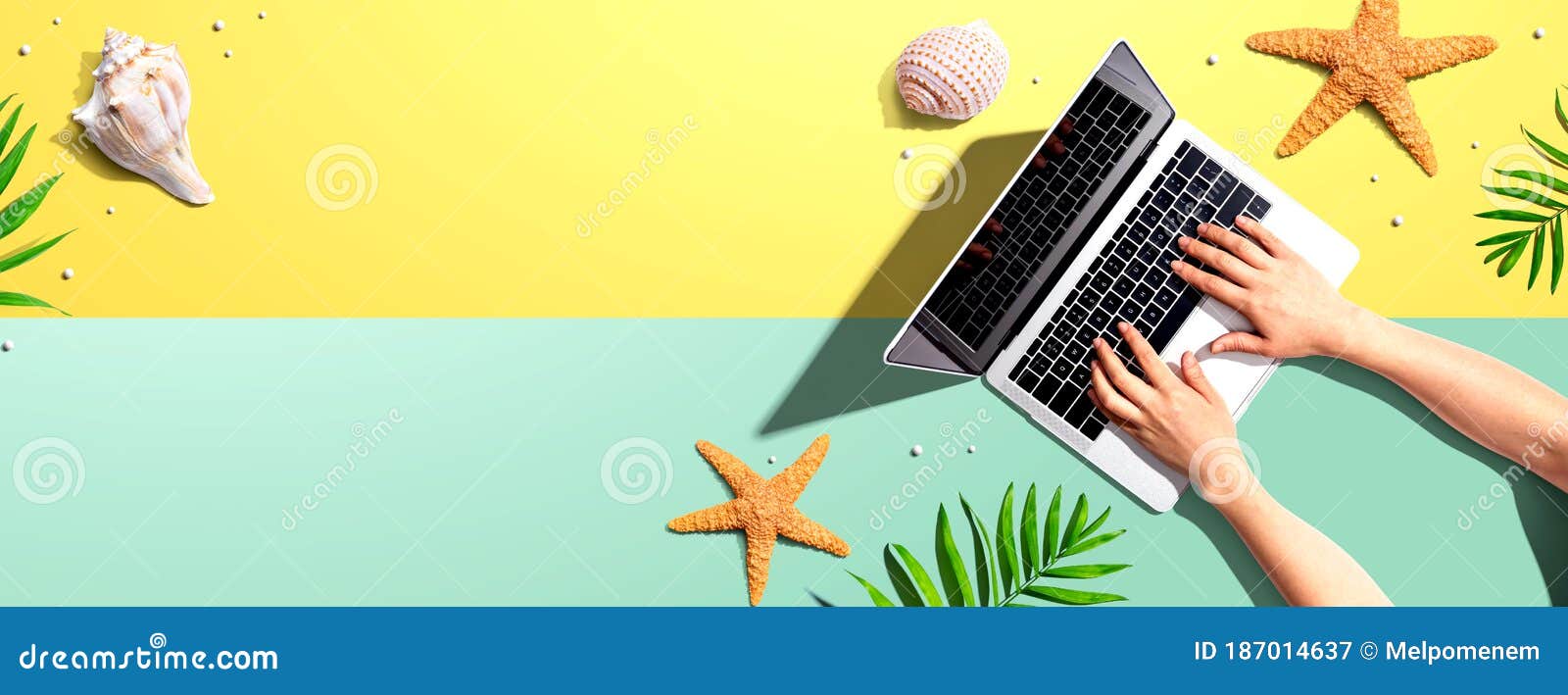 Person Using a Laptop Computer with Summer Theme Objects Stock Image ...